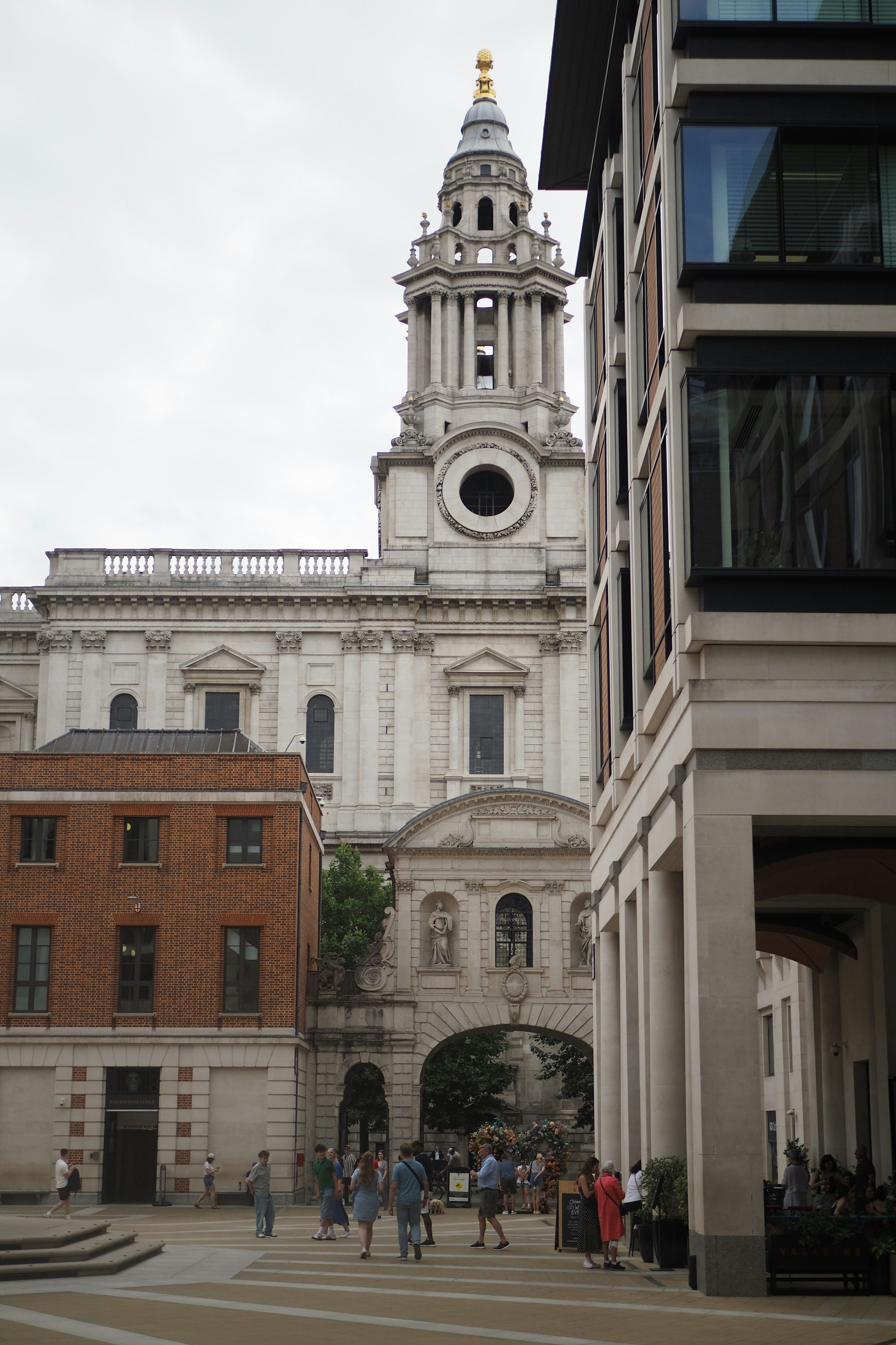 Archway of Time: A Baroque Facade Framed by Modern Glass