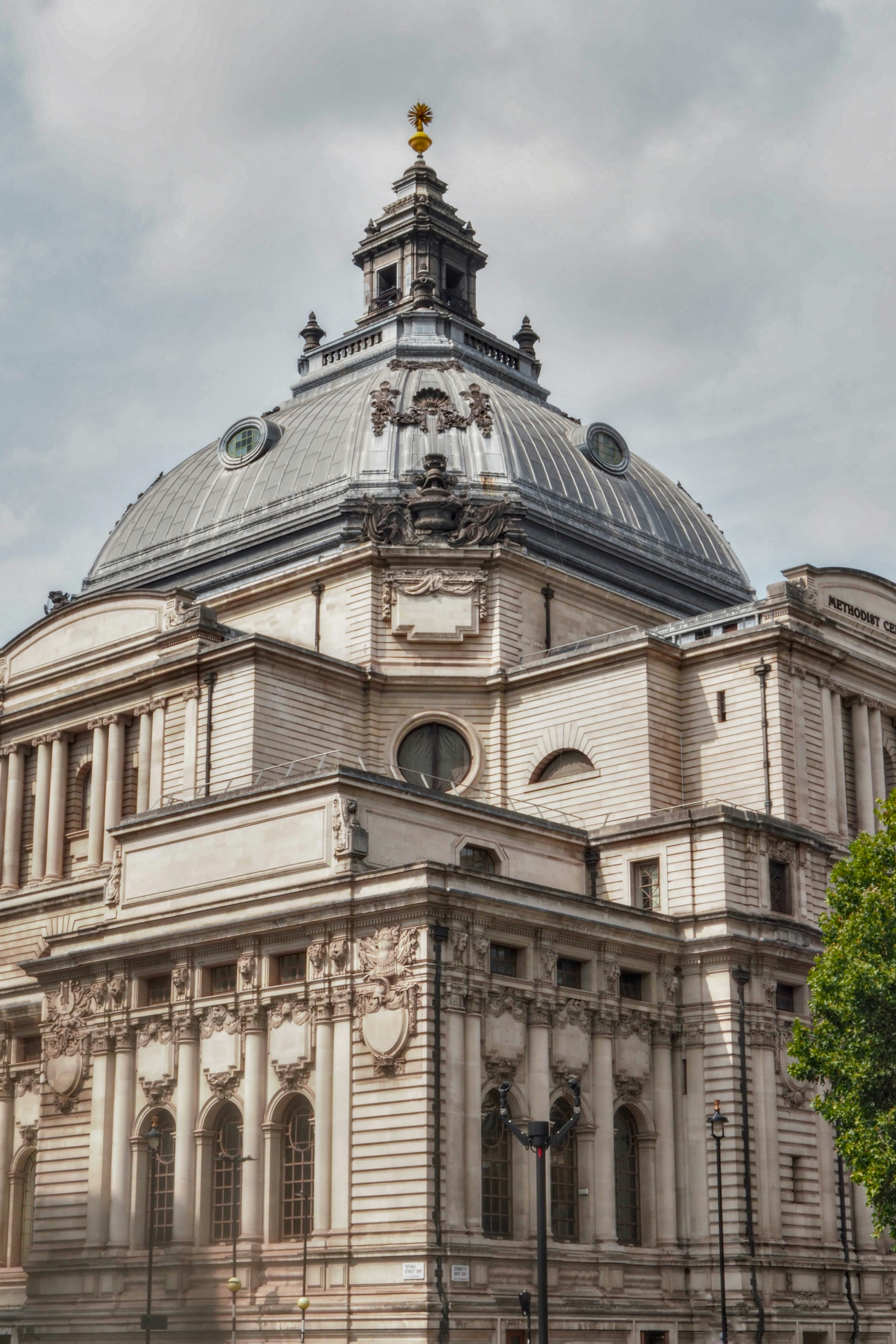 Artful Dome: The Grand Beaux-Arts Facade Under a Clouded Sky