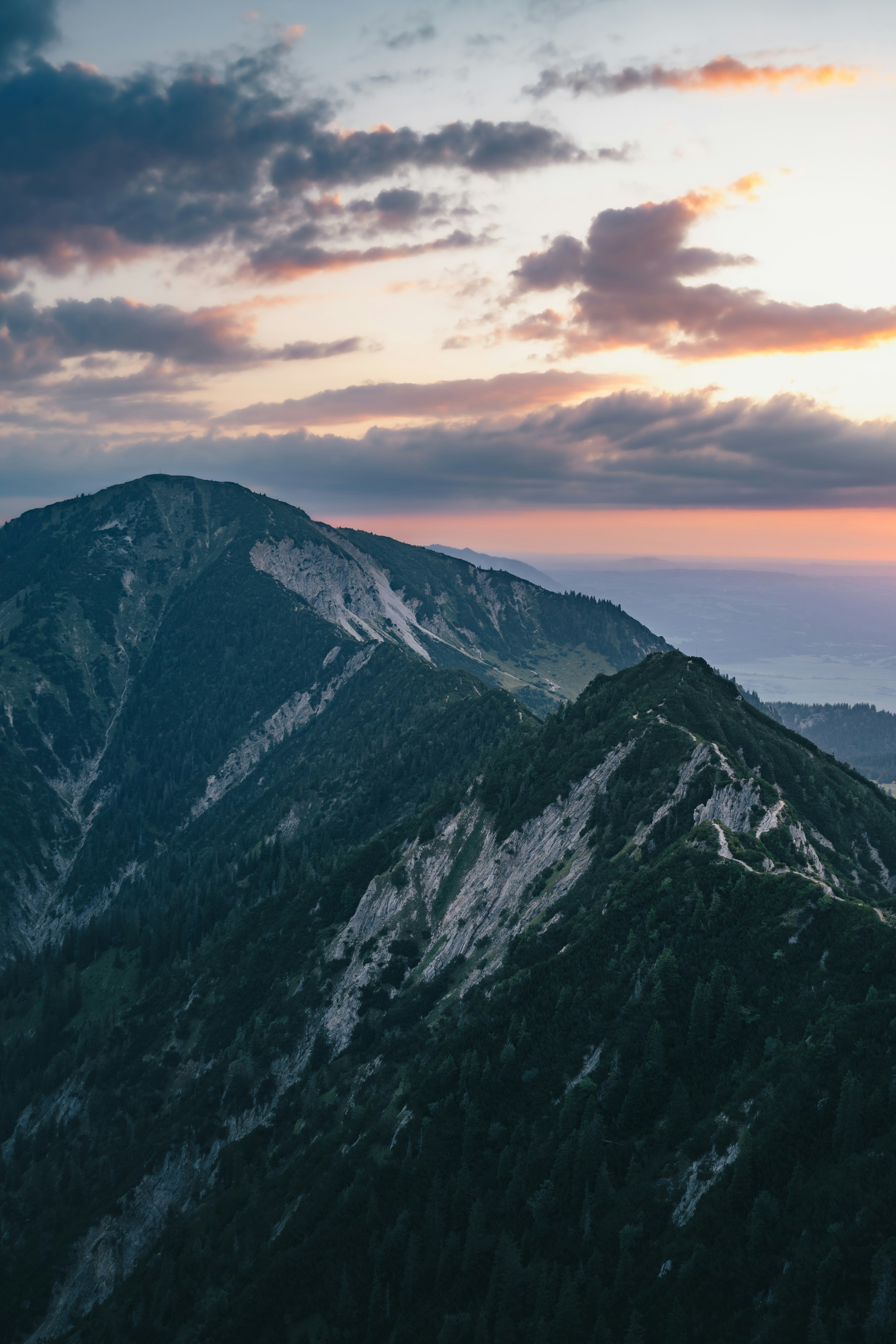 Sunset Ridge: A Looming Crest Beneath Painted Skies