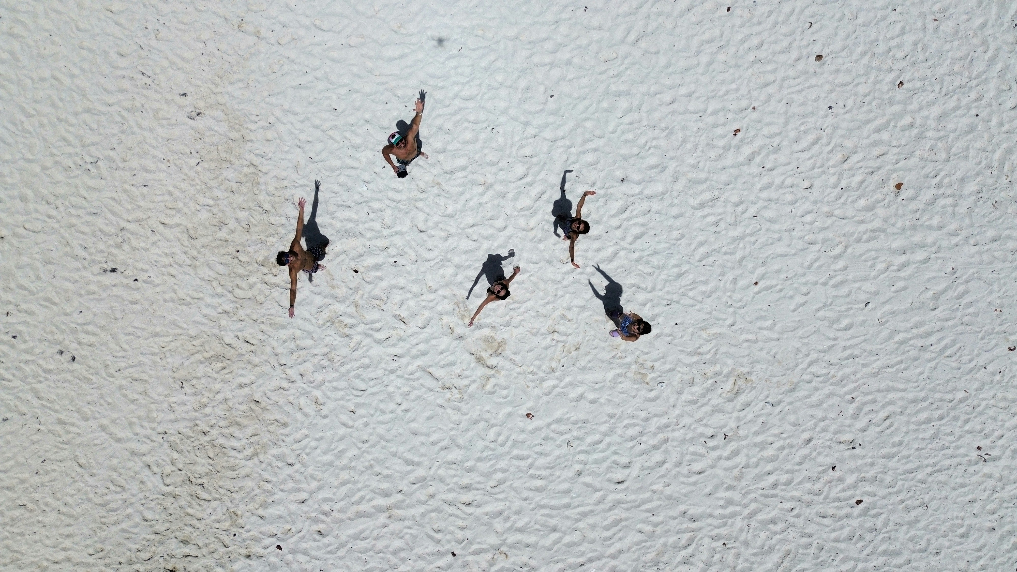 Six Tiny Figures on a Salt-Cpeled Canvas