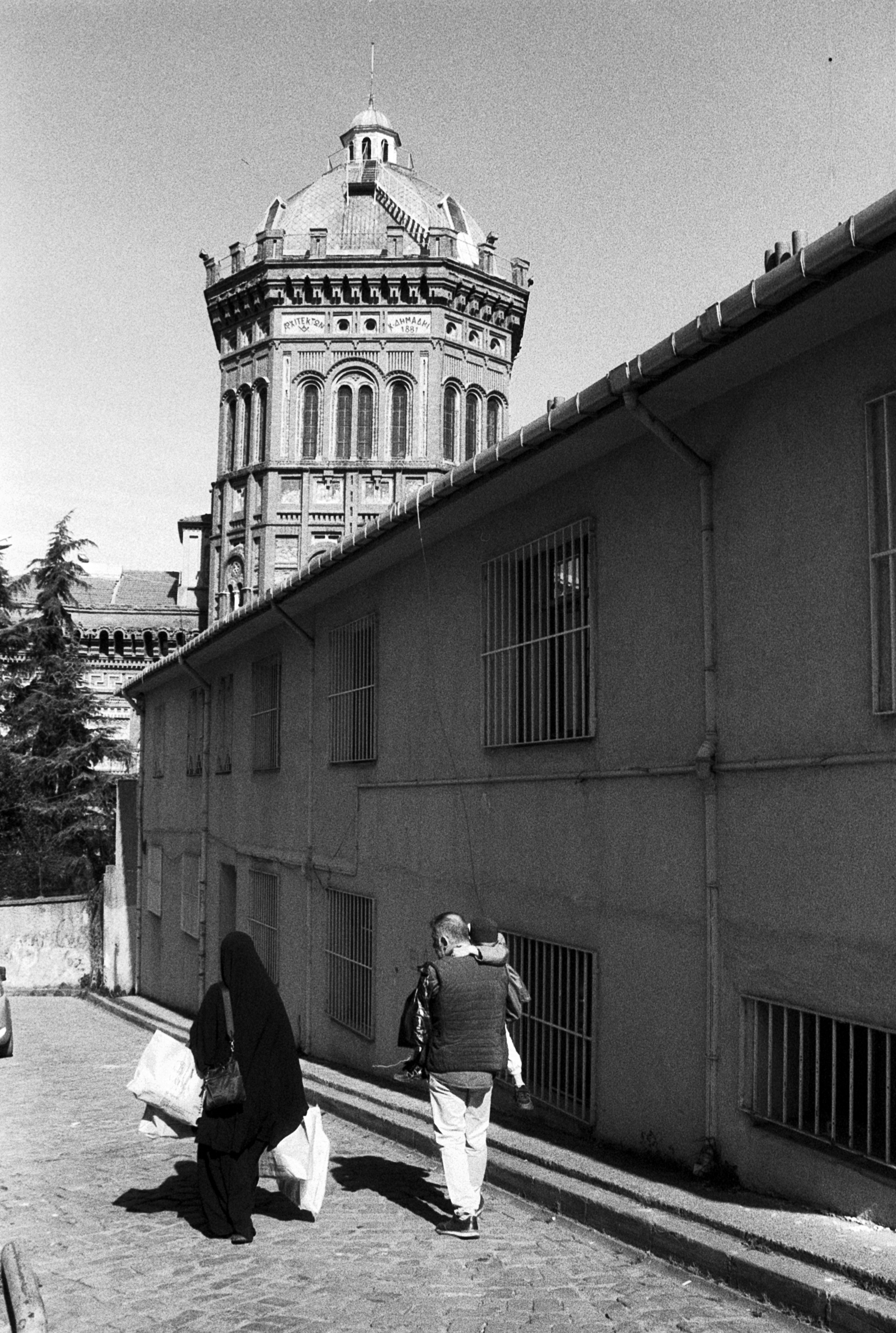 Clock Tower Over Courtyard: A Quiet Stairway into History