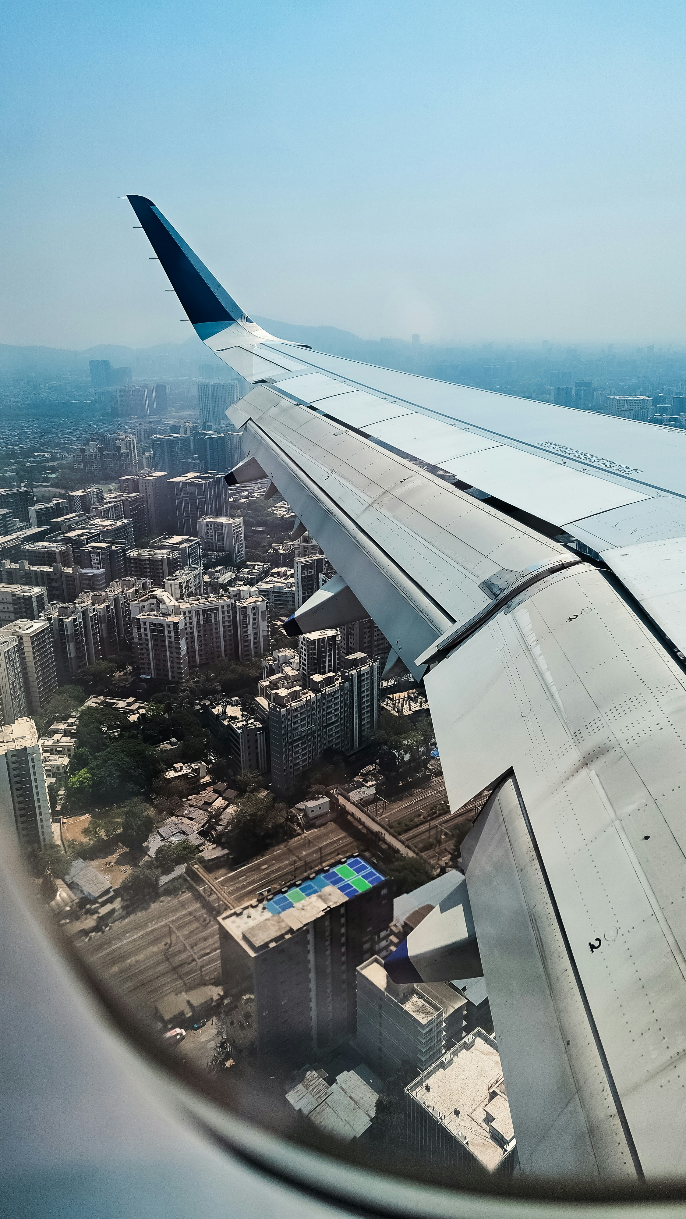 Wing Over the City: A Window Seat Perspective from Above
