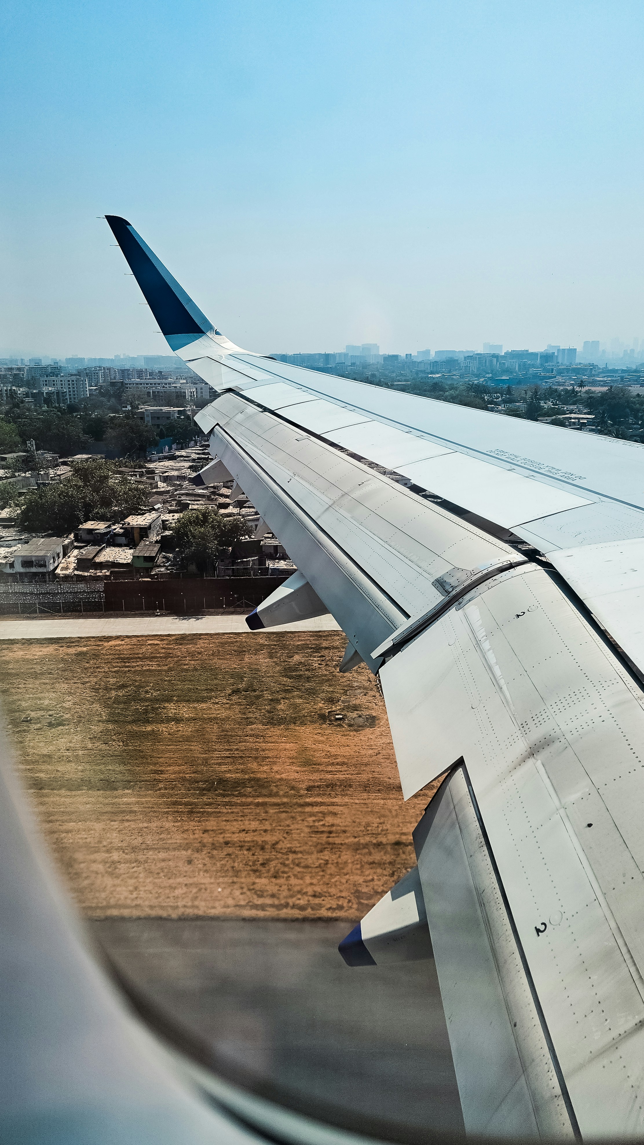 Winged Perspective: Cityscape Unfolds Beneath a Receiver of Light