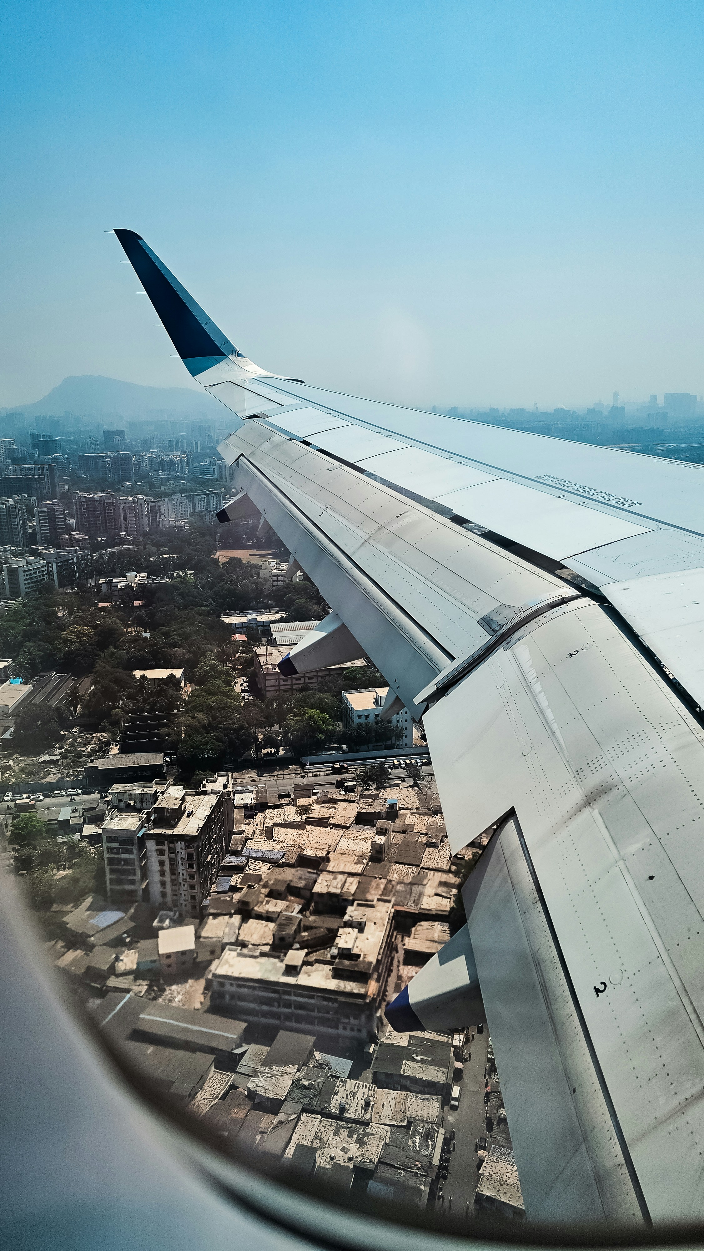 Wingscape Over a City: A Clear Outlook from a Passenger Window