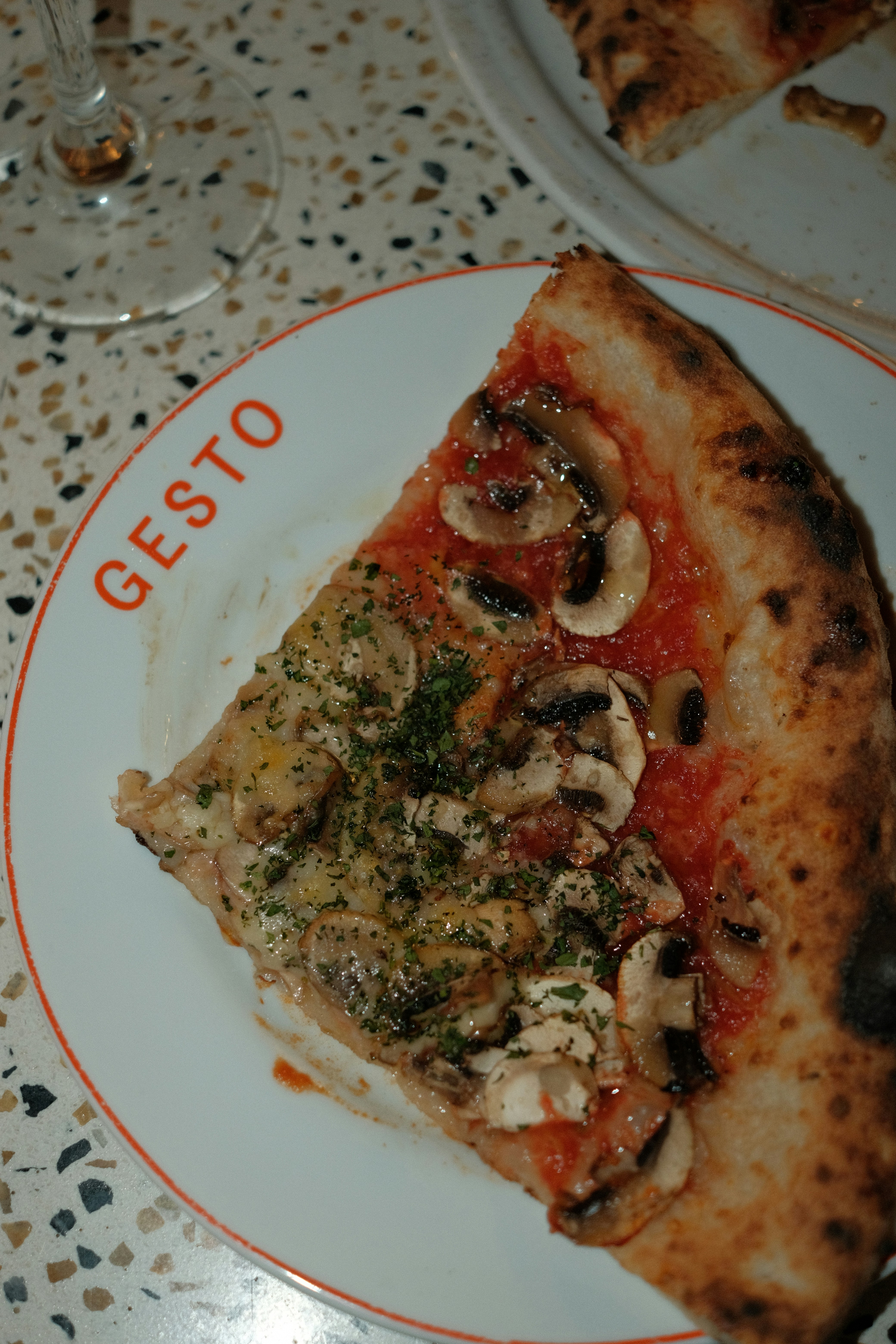 Slice of Gourmet: Mushroom and Herb Pizza on a Gesto Plate
