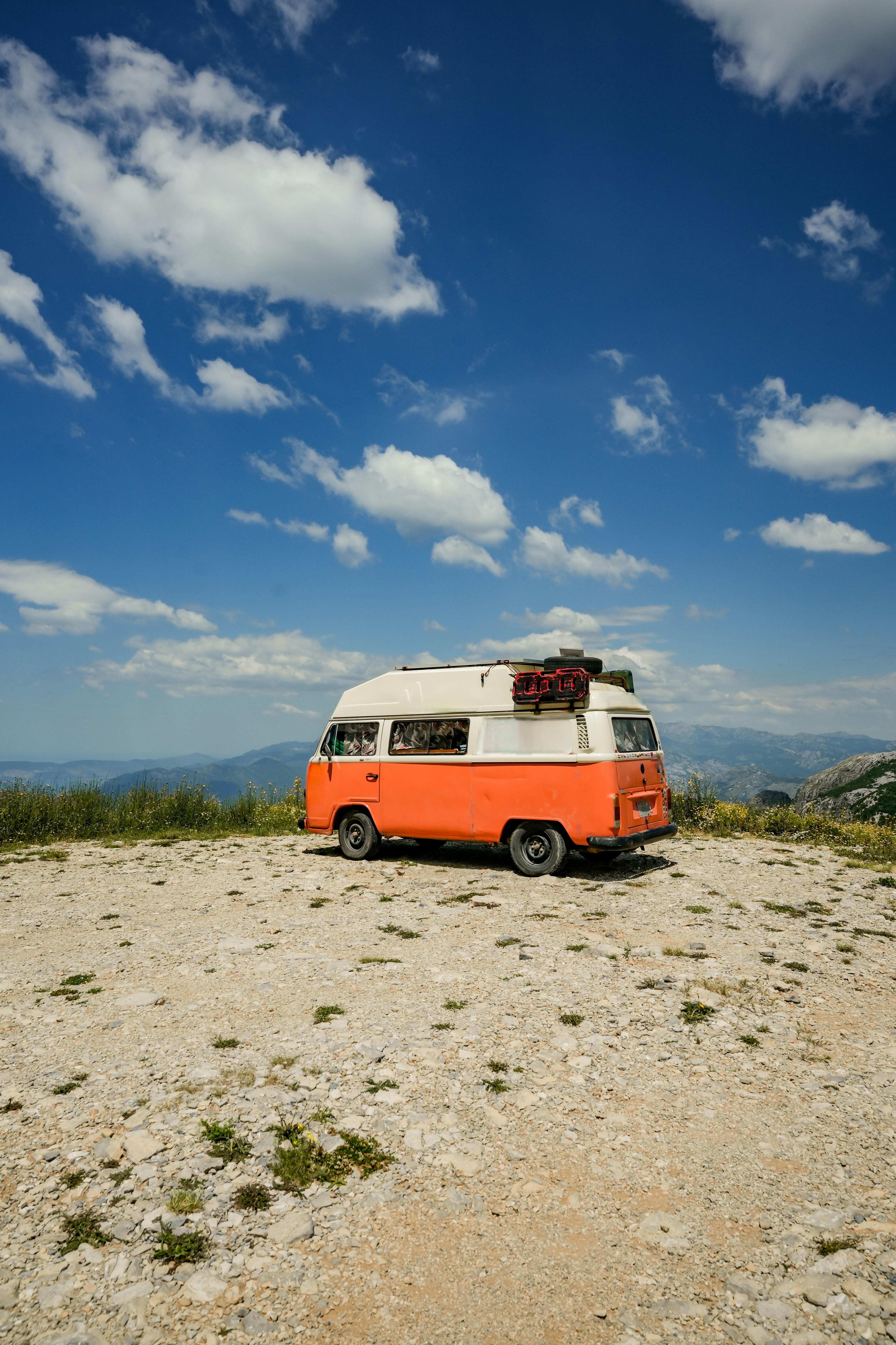 Orange VW on a Hilltop Horizon