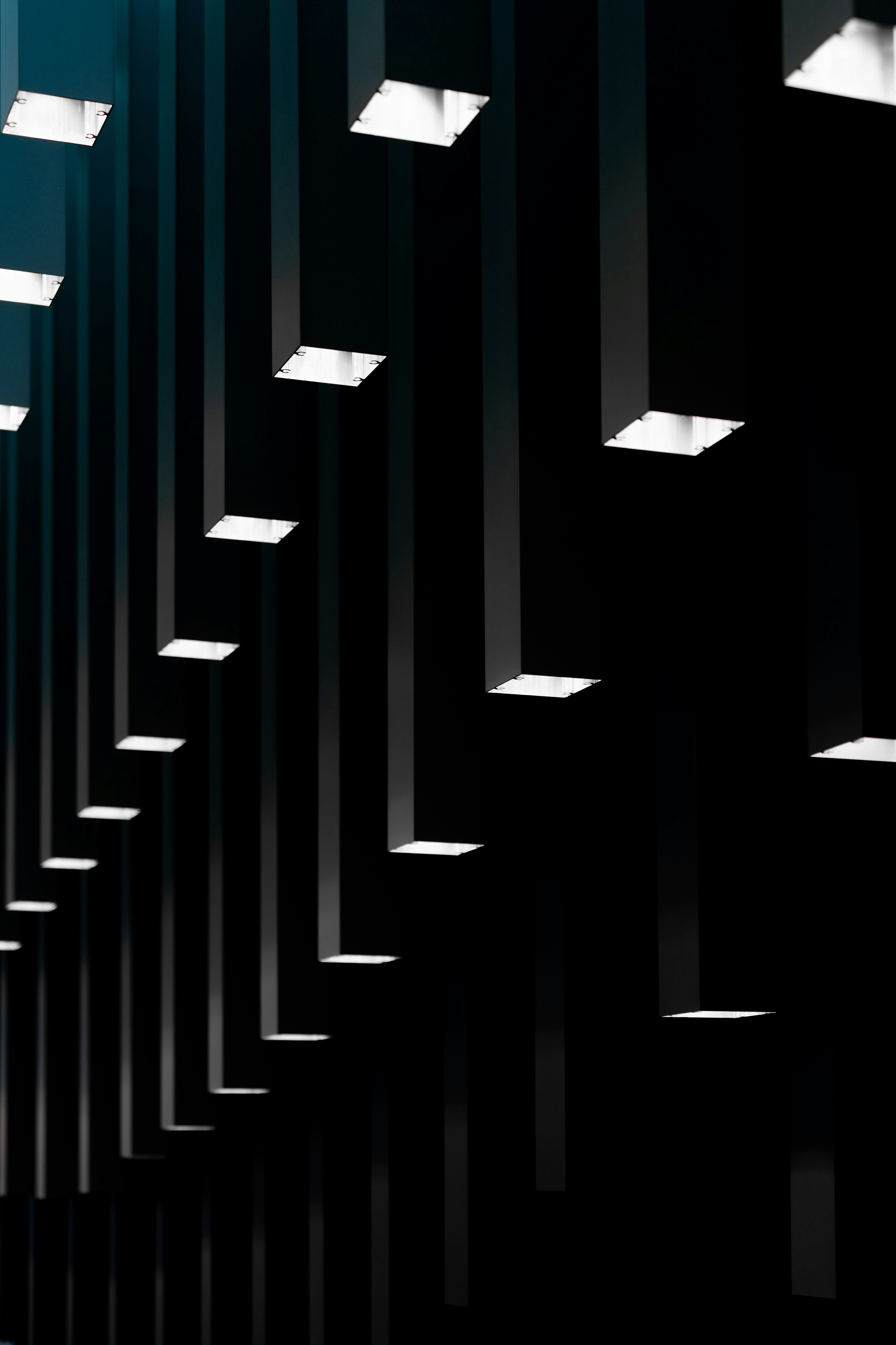 Luminous Recession: Vertical Light Casts in a Monolithic Corridor