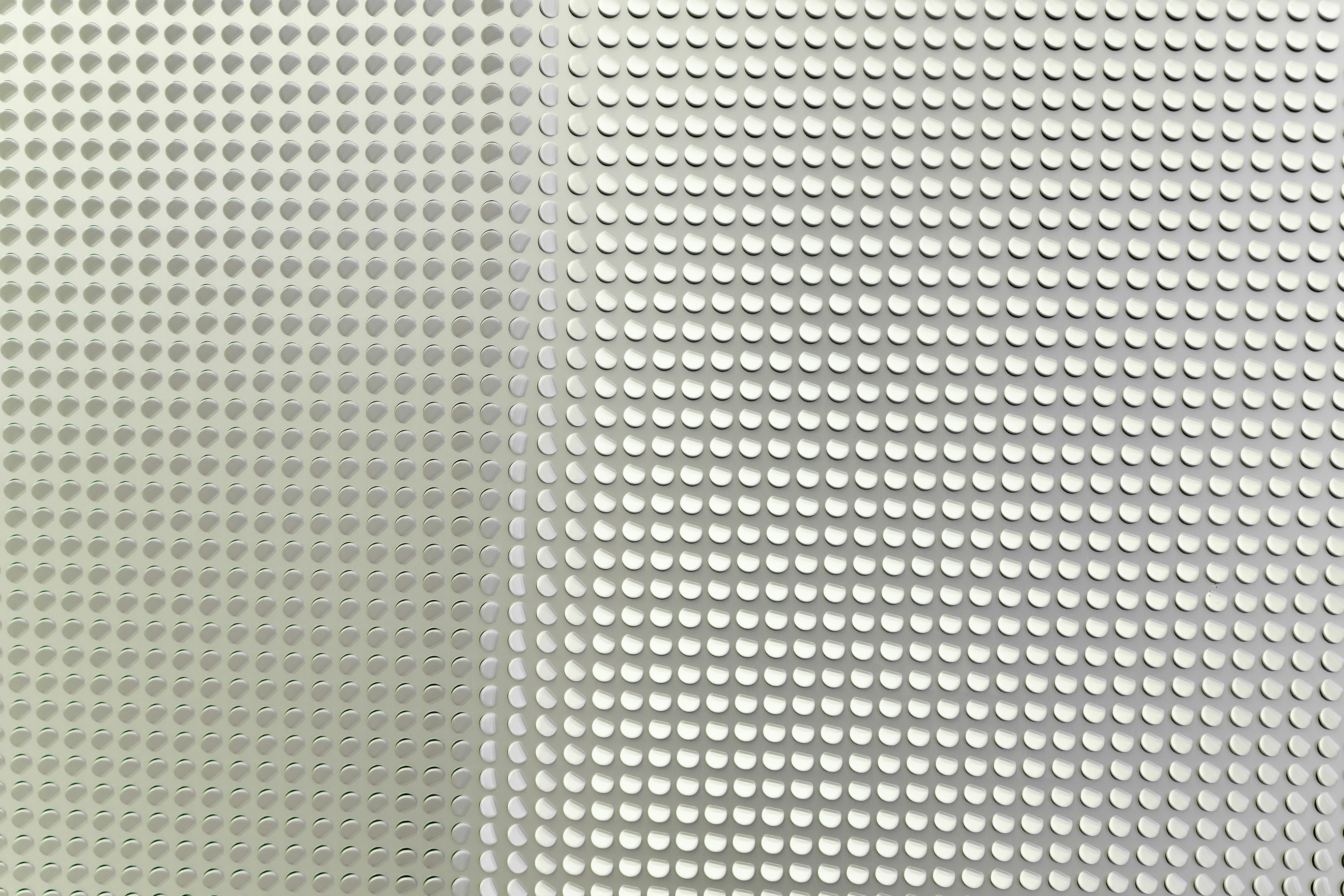 Echoes of Dimpled Steel: A Close-Up of Repeating Perforations