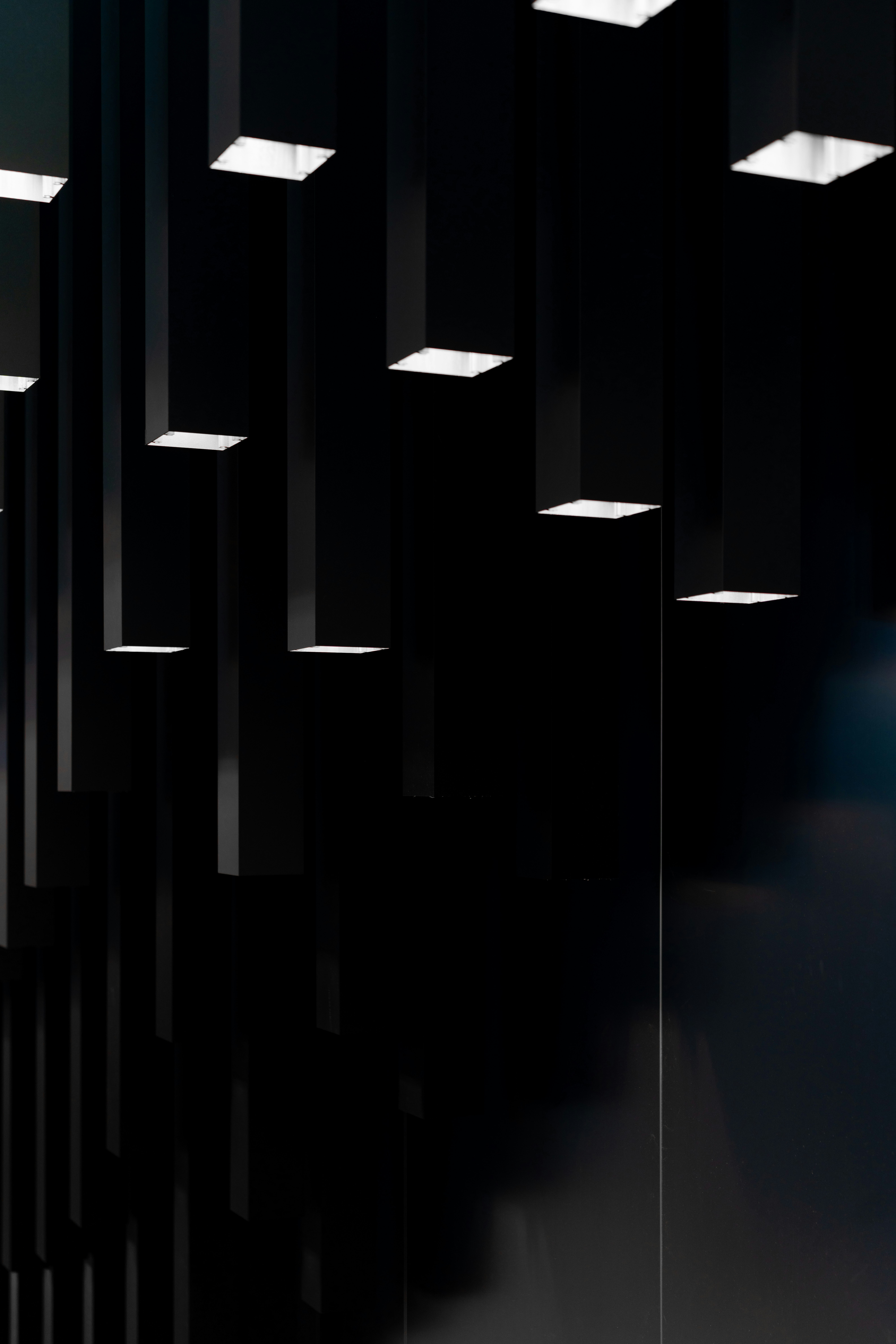 Minimalist Pendants: Towers of Light in Shadow
