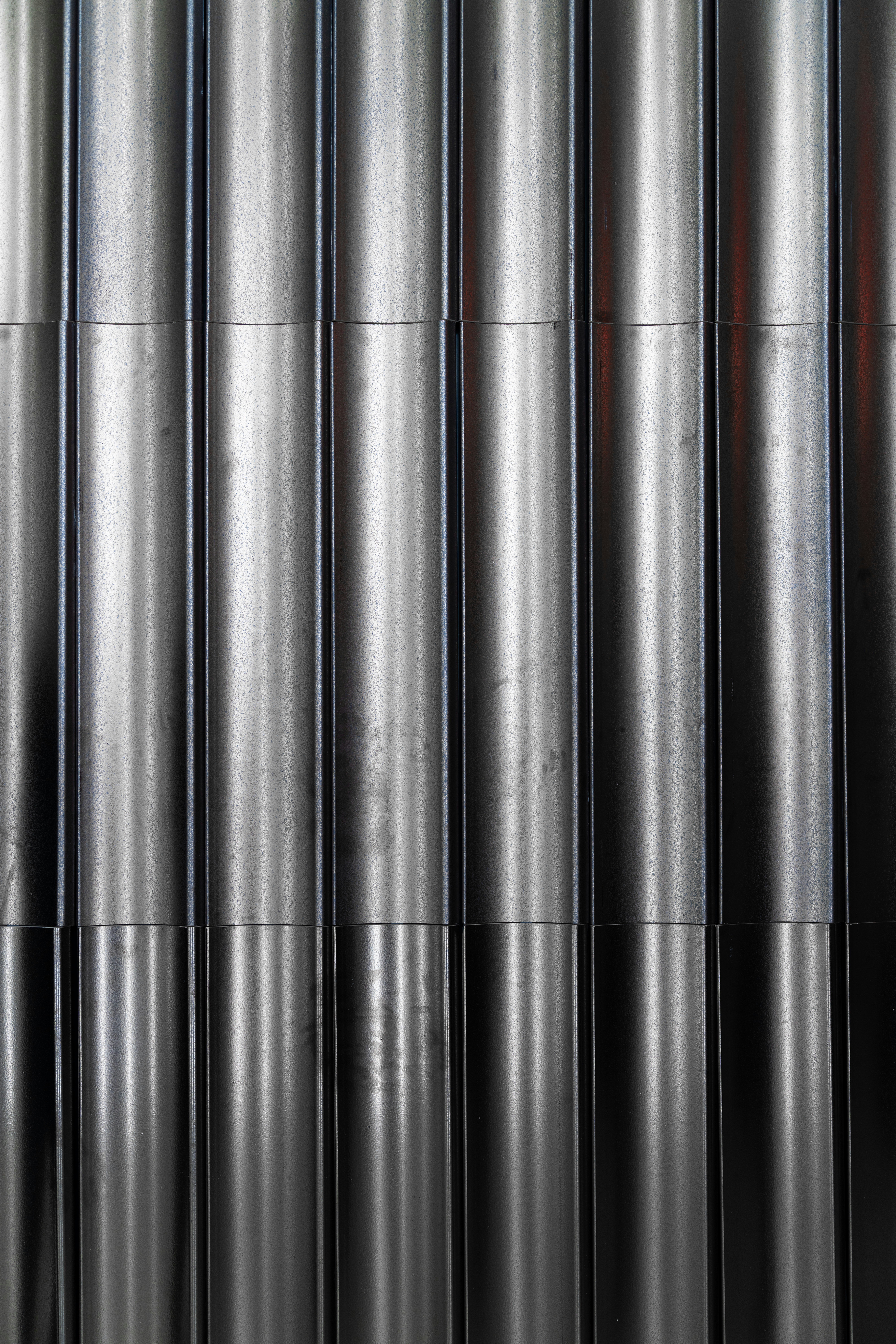Vertical Echoes: A Close-Up of Industrial Metal Tubes