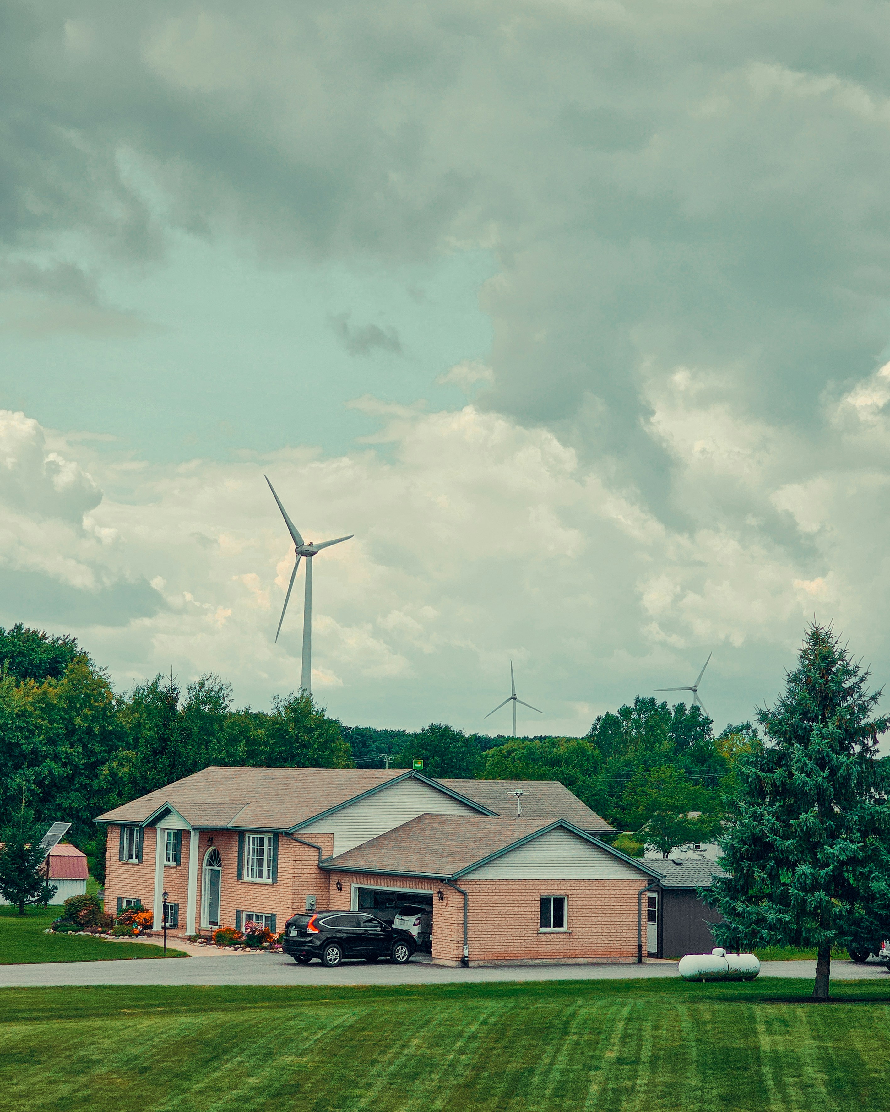 Wind Turbines Watch Over a Quiet Suburban Street