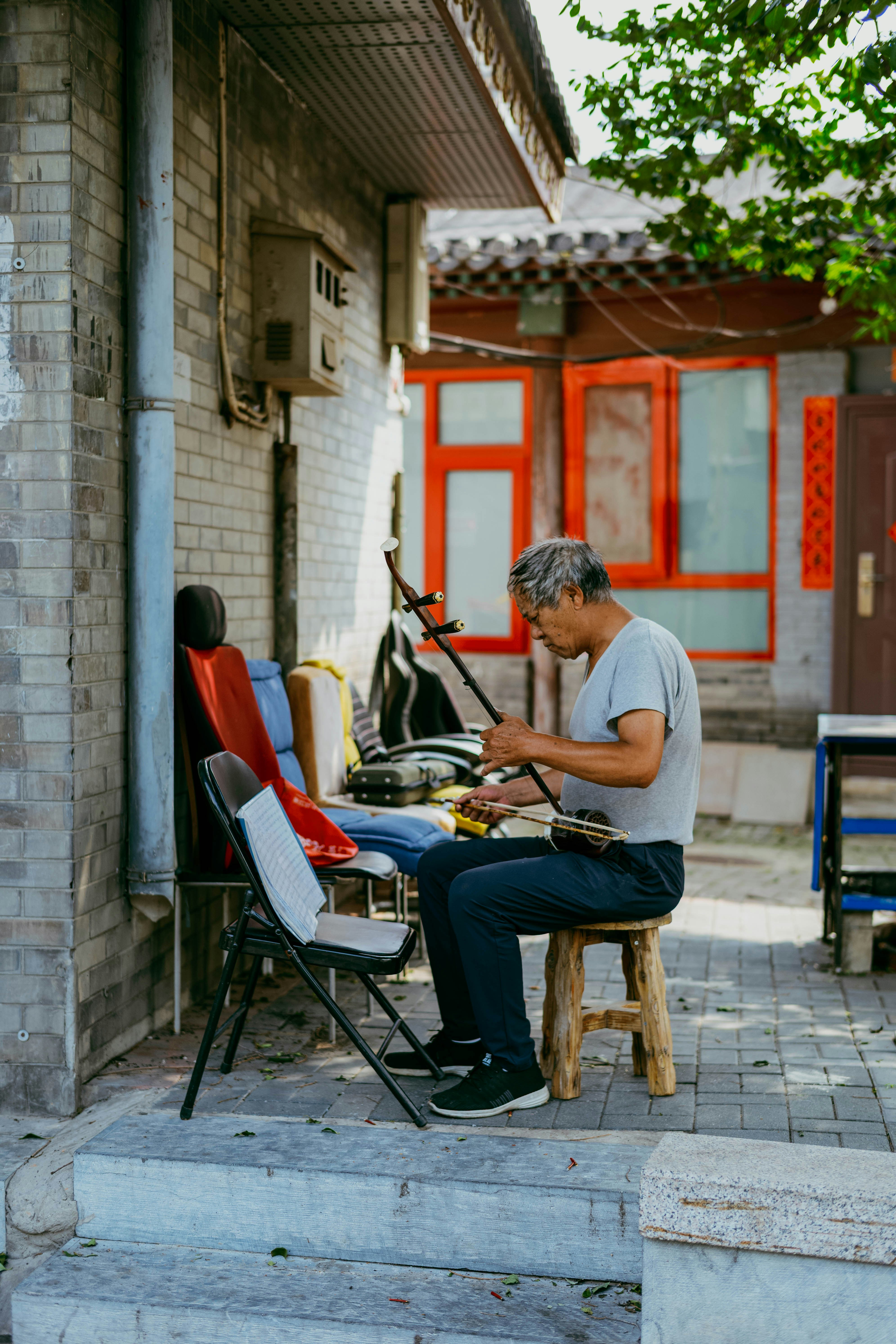 String melodies in a sunlit courtyard portrait