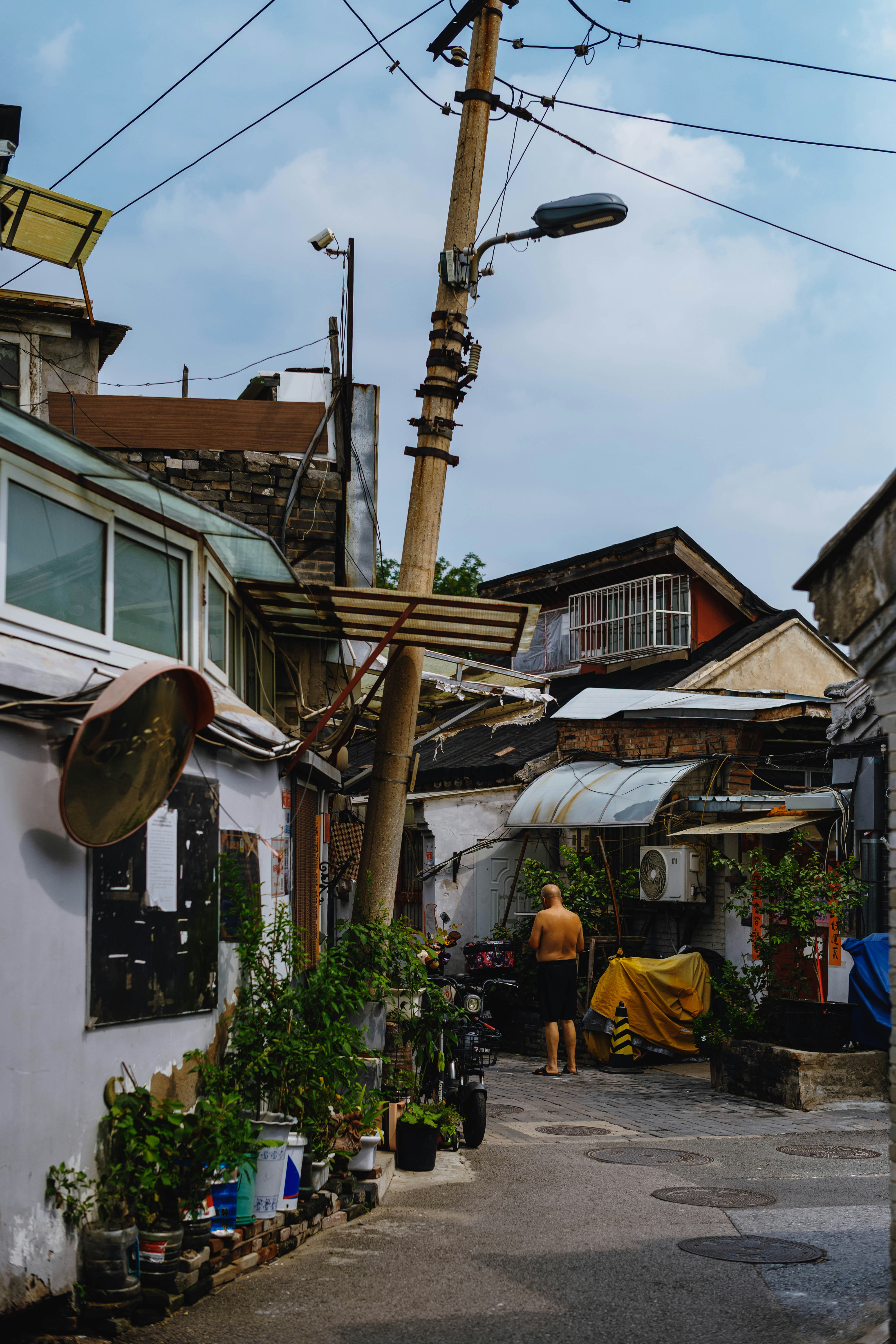 Sunlit Alleyway: Life in a Turreted Urban Nook