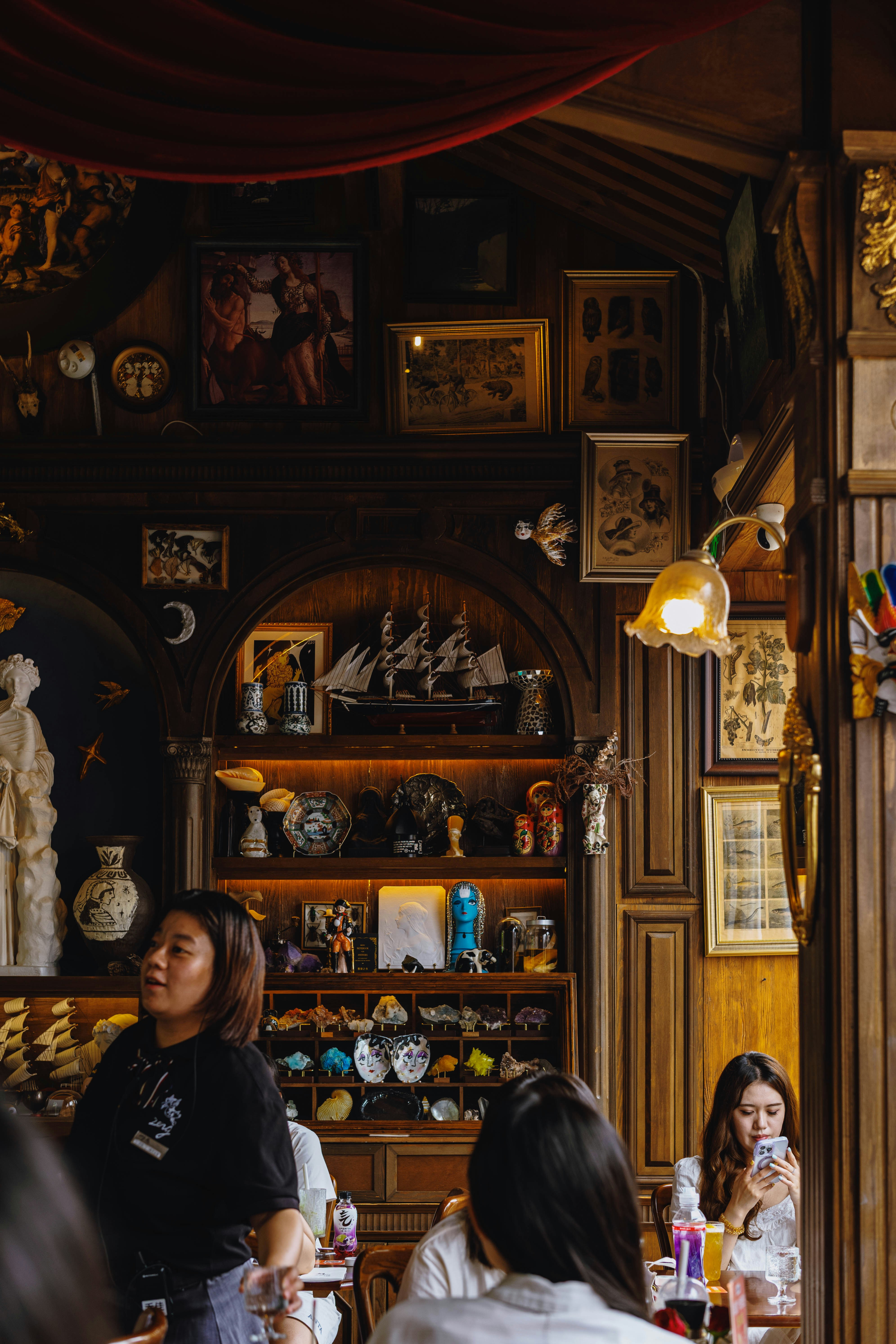 Curio-filled Parlor: Portraits and Porcelain in Warm Lamplight