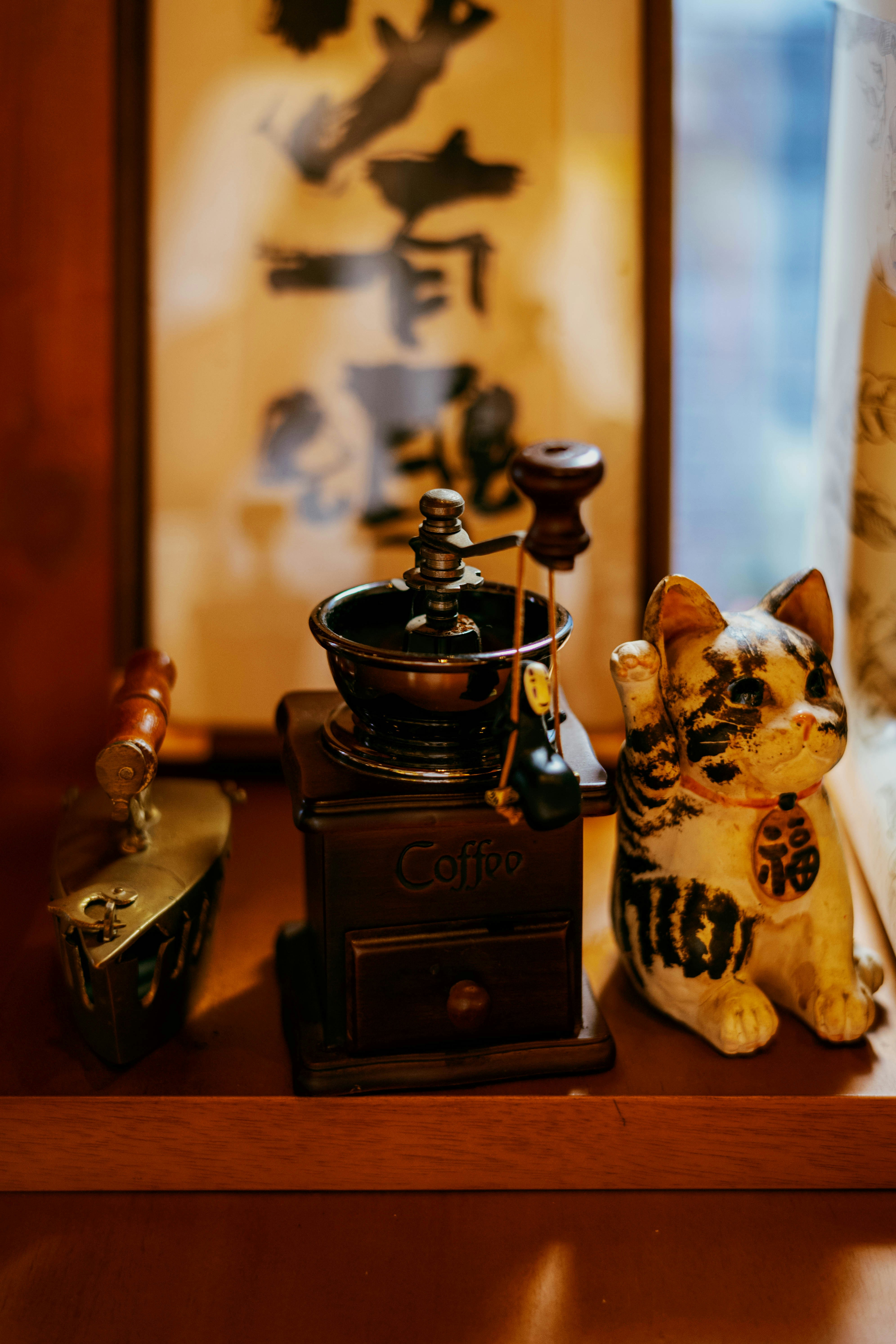 Old Coffee Grinder and Lucky Cat: A Quiet Corner of Craft and Charm
