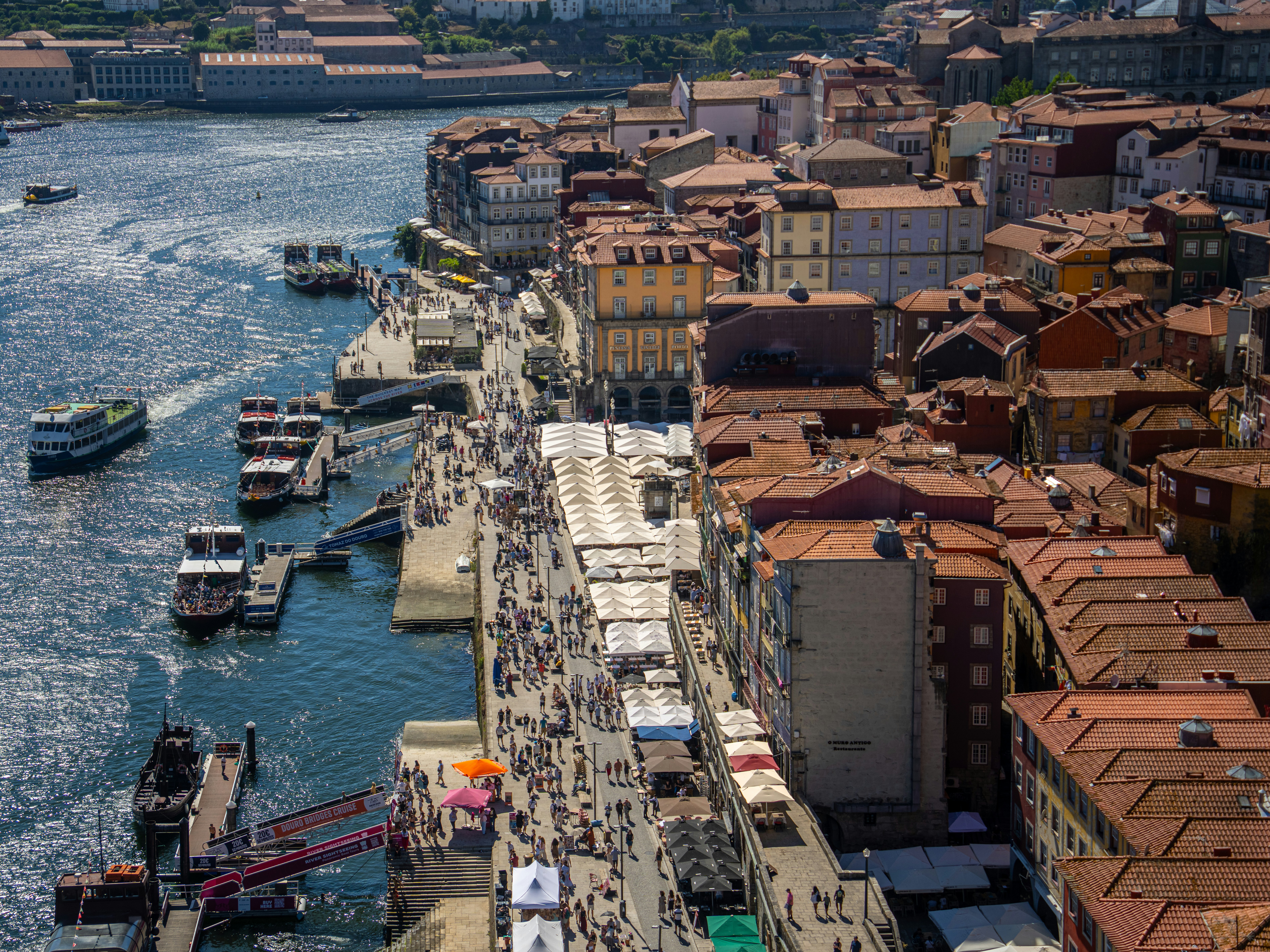 Harbor Promenade: A Sunlit Lane of Rooftops and Boats