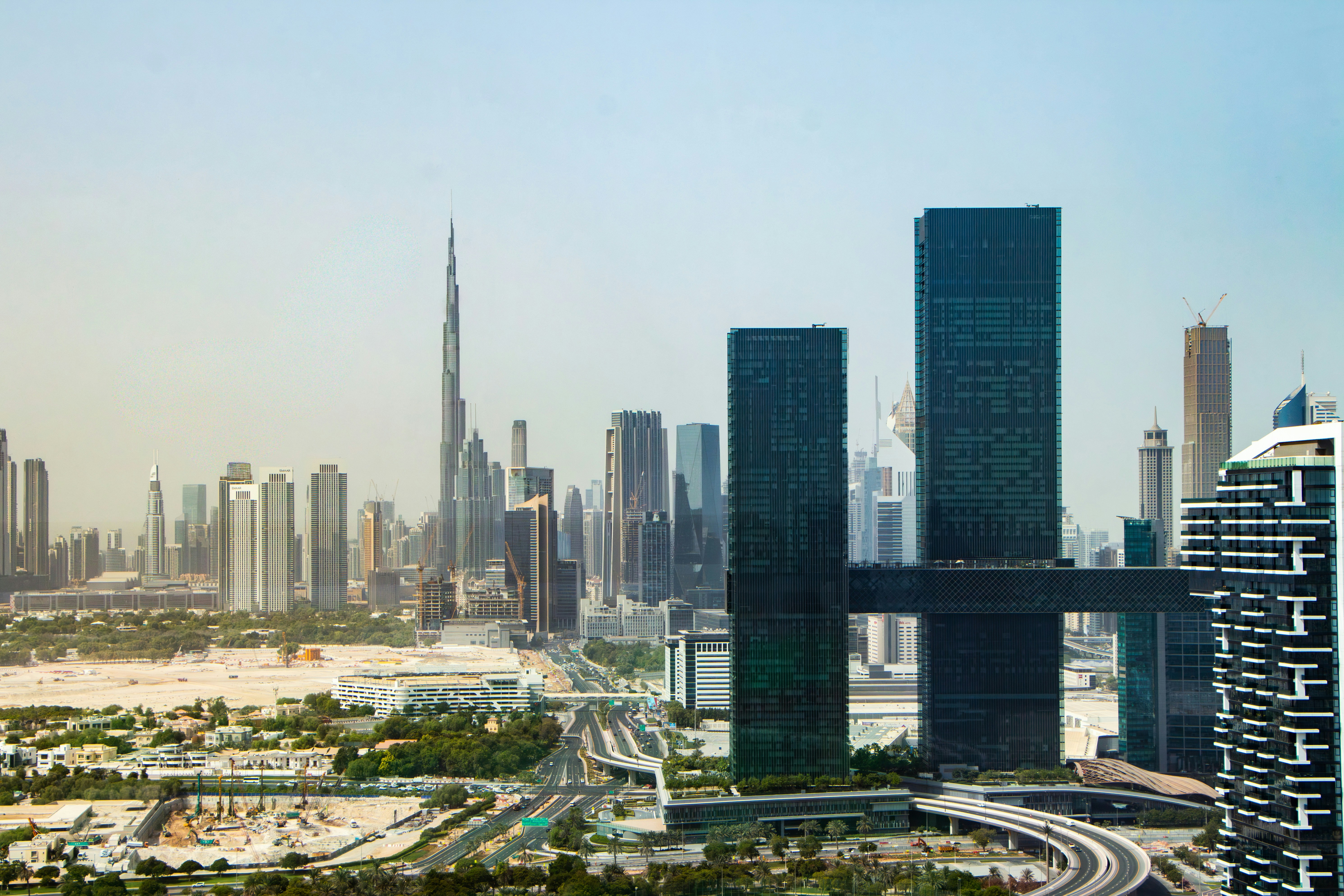 Dawn Over the Dubai Skyline: A Patchwork of Glass and Highway Arteries