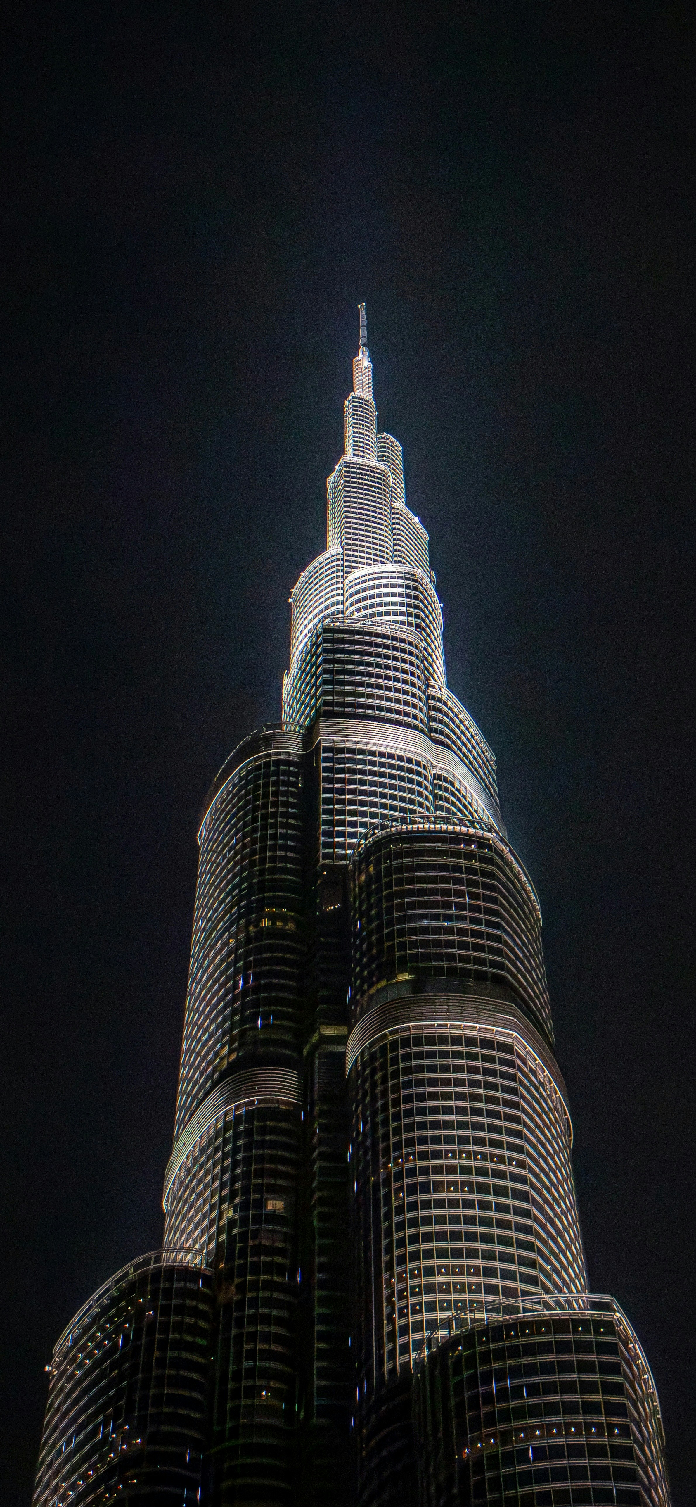 Tongues of Steel: The Burj Khalifa Ascends into Night