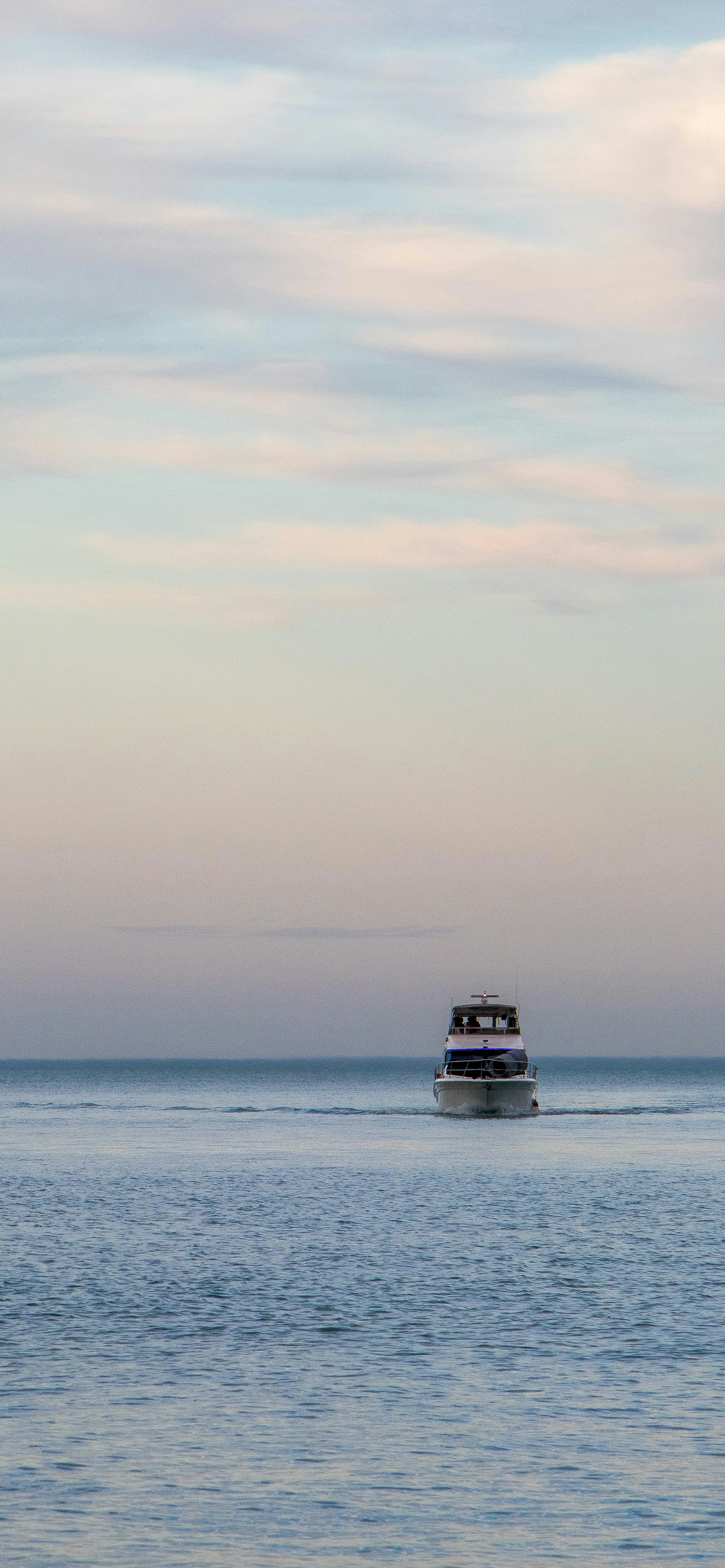 Boat in a Calm Horizon: A Quiet Seascape at Dusk