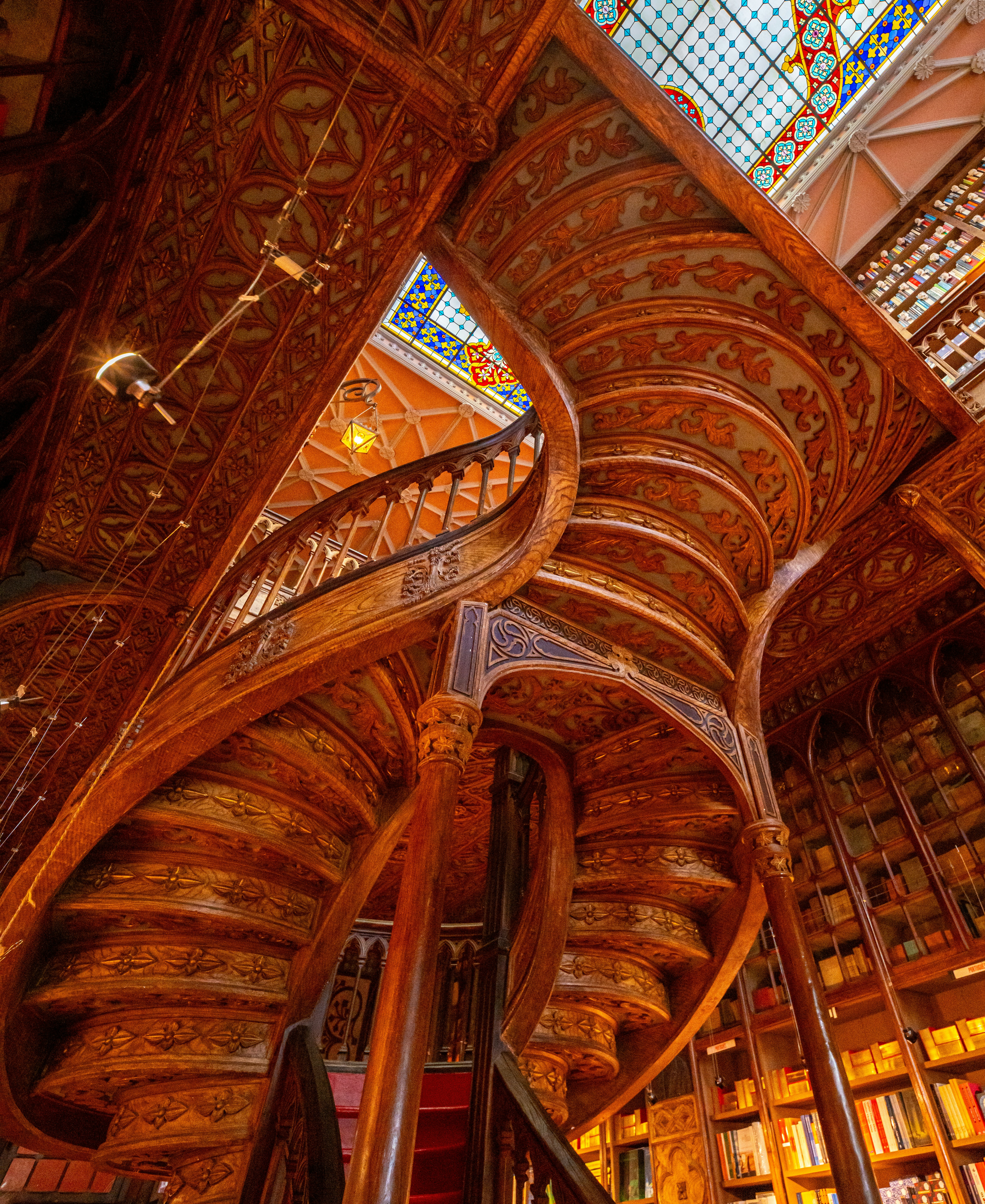 A Whispering Staircase: Carved Wood and stained glass in a library of curls