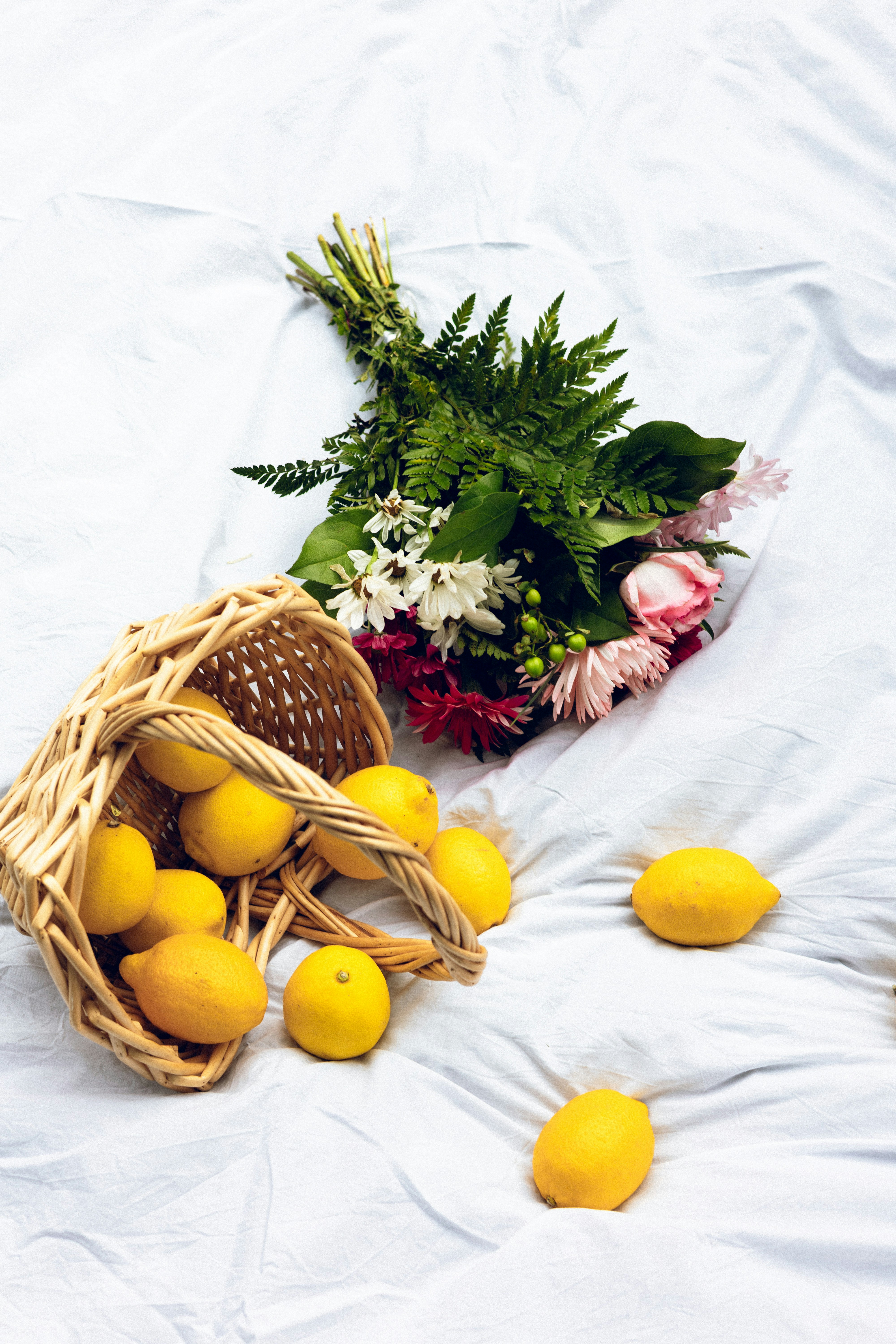 Lemons and Bouquet on a White Linen Canvas