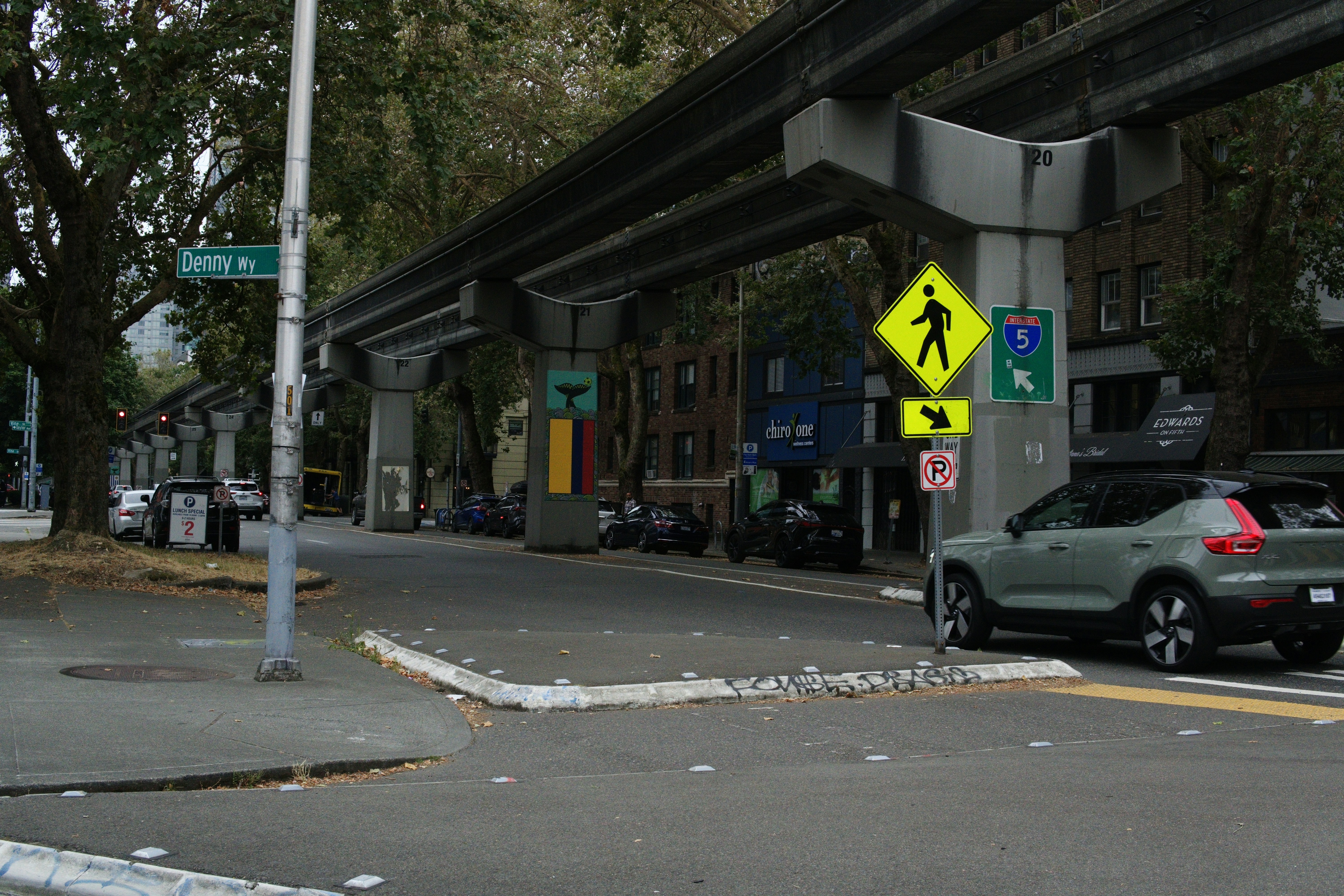Crossing Under the Elevated Rail: A Quiet City Corner