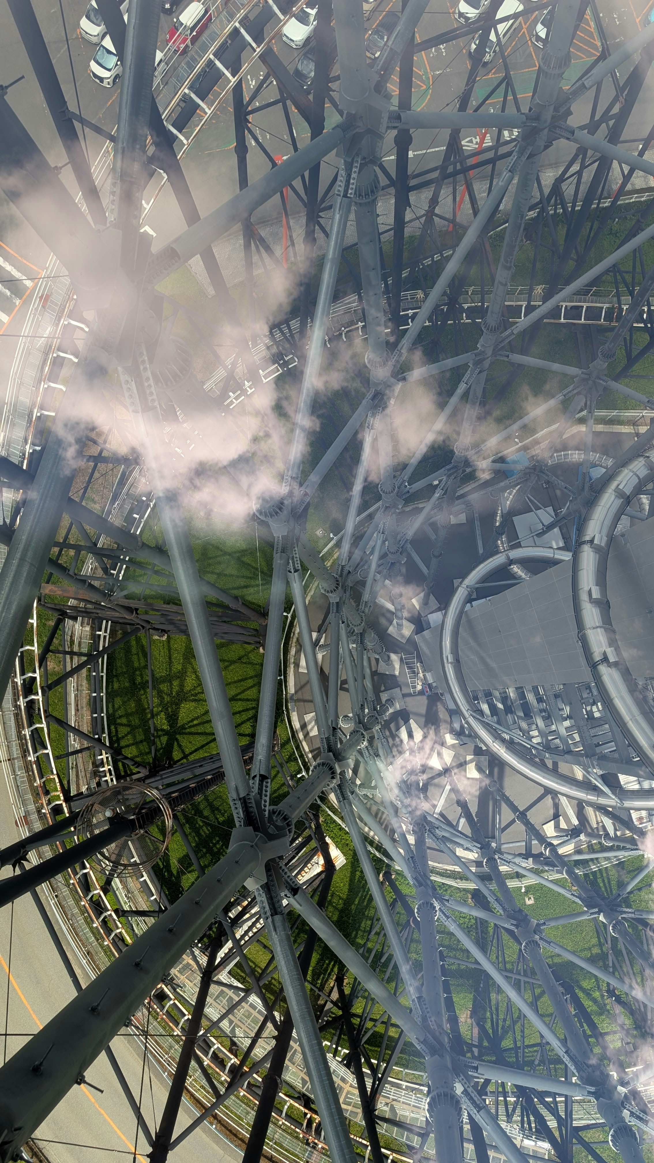 Spiral of Steel: A Towering Climb Through Clouded Lattice