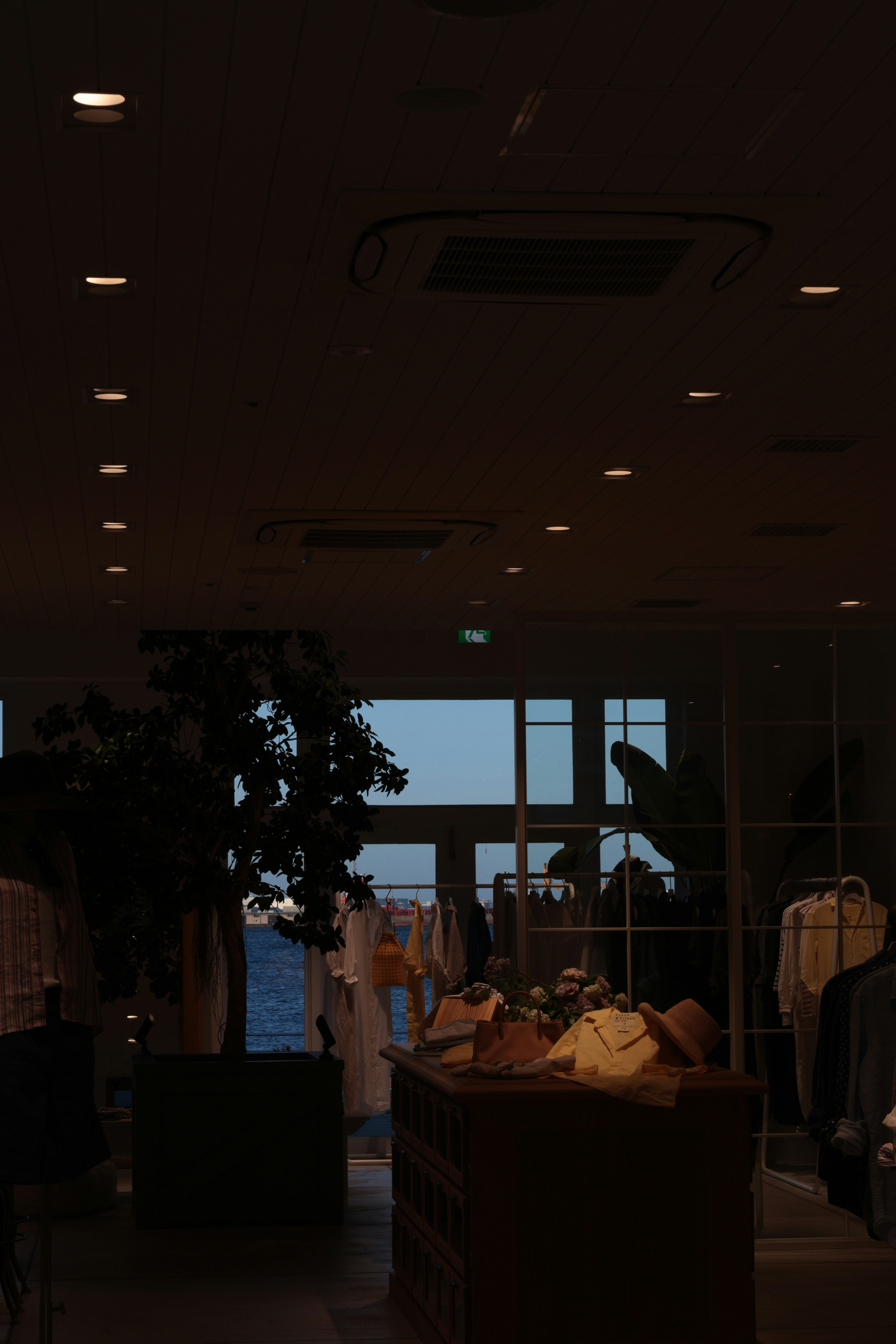 Dim Boutique at Dusk: Subtle Window Light Framing a Quiet Store Interior