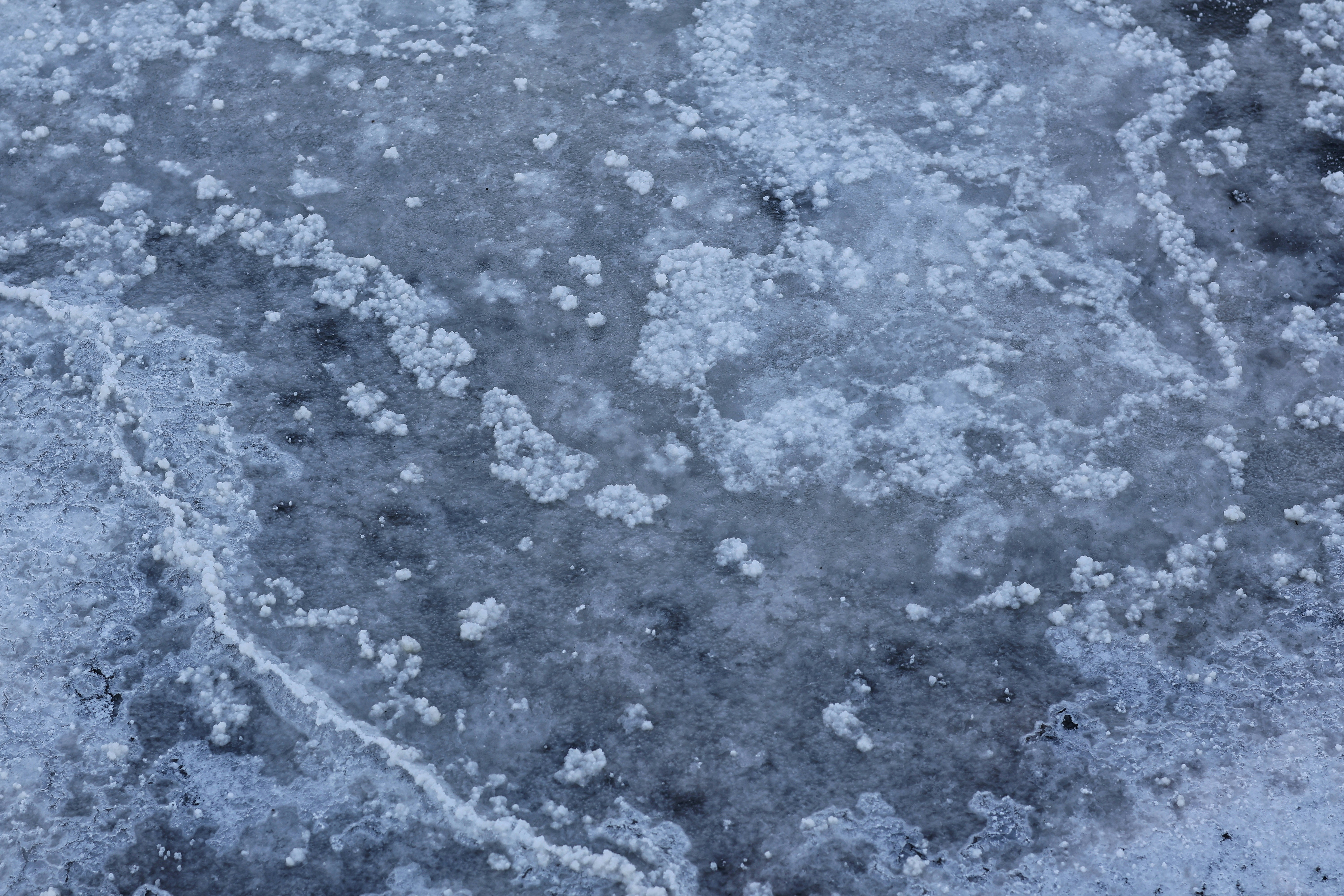Frozen Mosaic: Ice Crystals Pattern Across a Quiet Surface