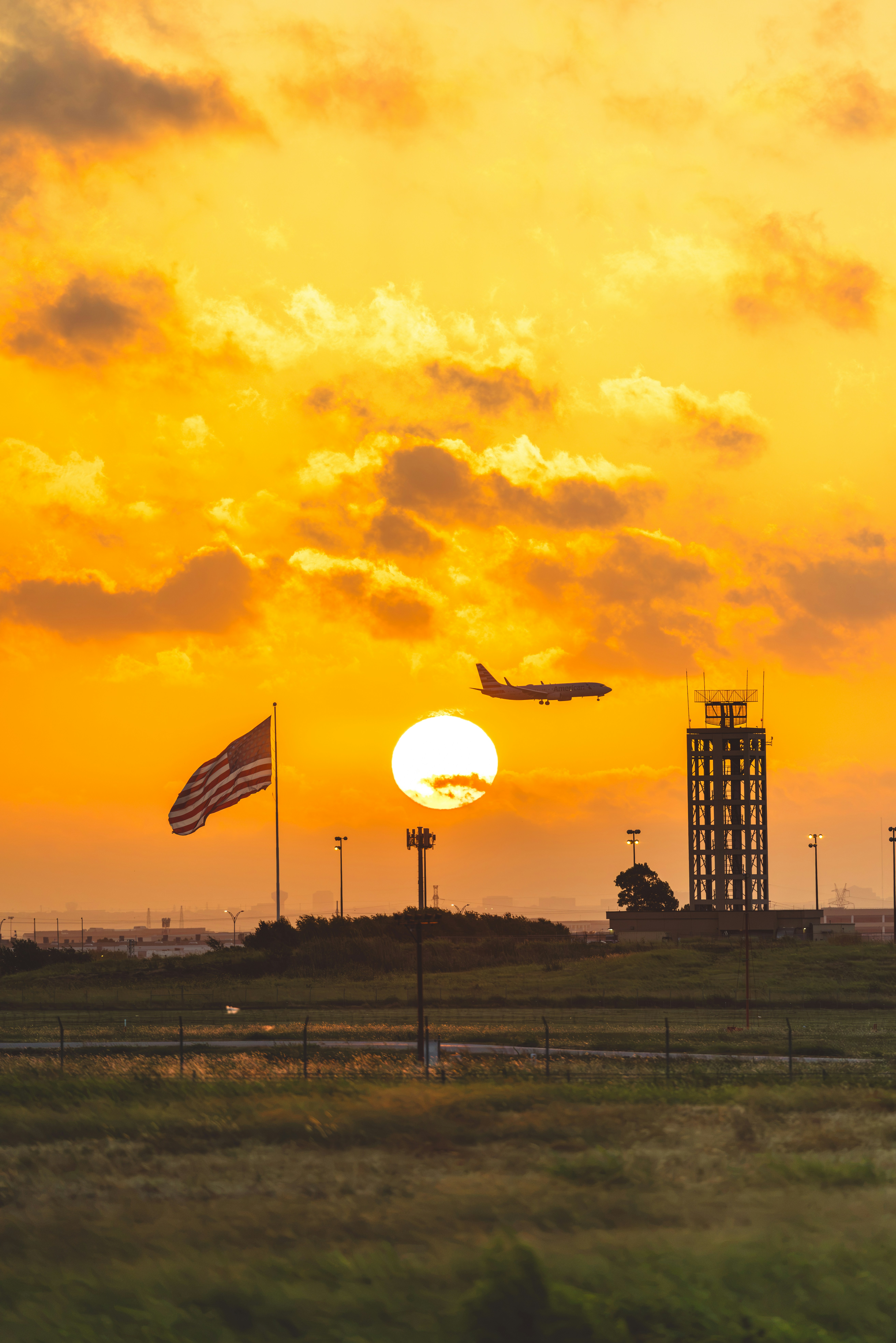 Sunset Runway: Aircraft Crossing the Fiery Horizon