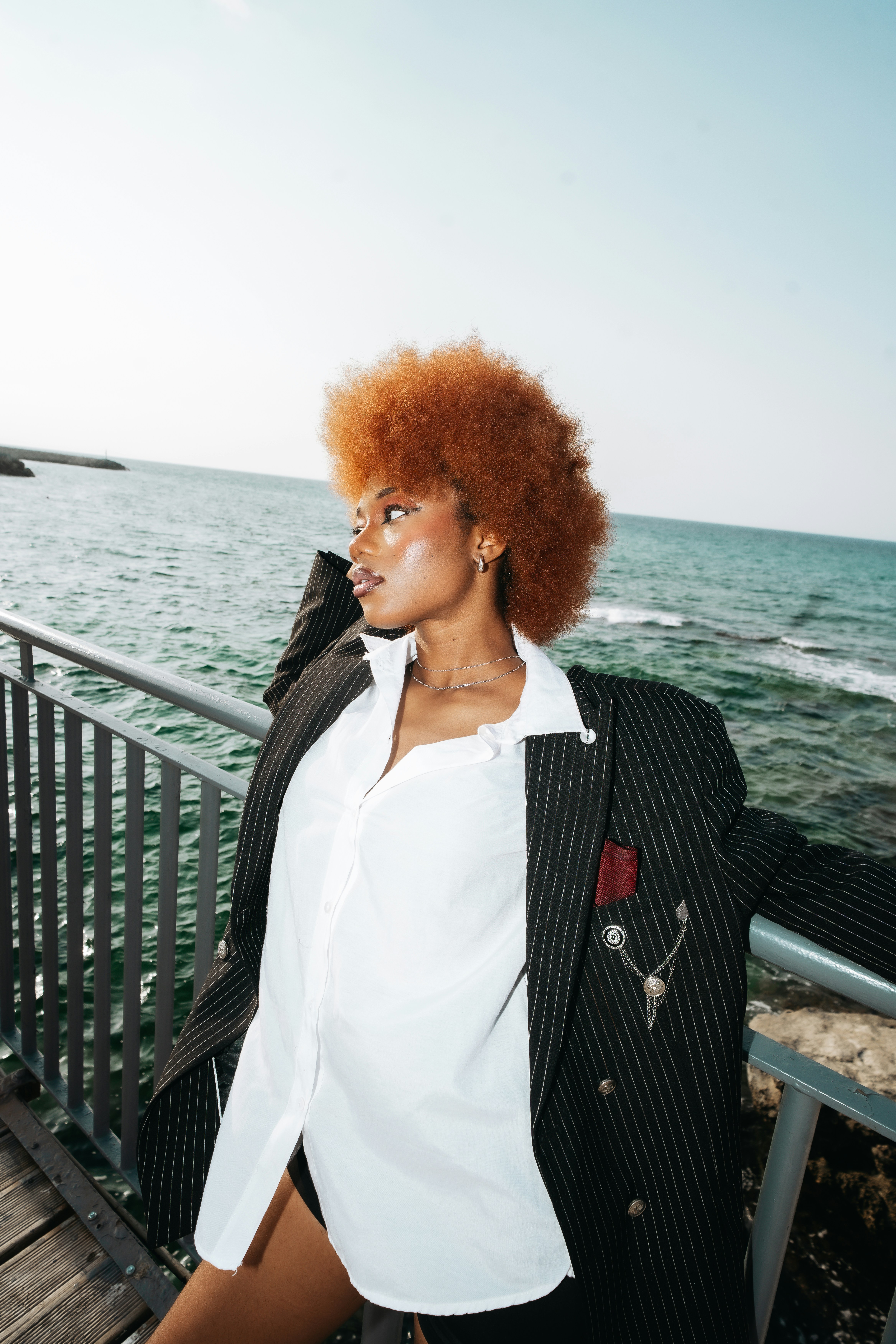 Coastal Confidence: A Striking Portrait by the Ocean