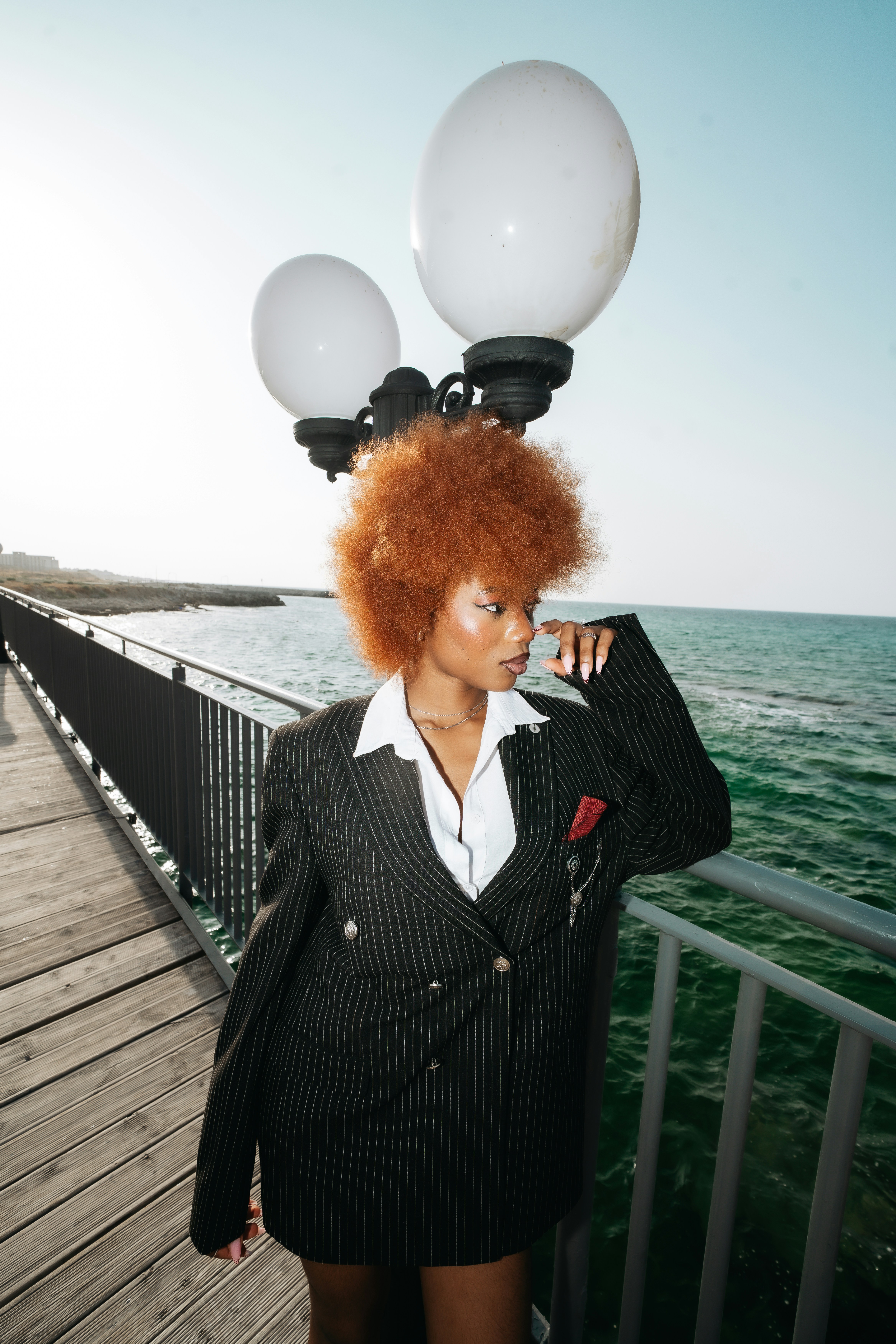 Power Suit on the Pier: Afro, Pinstripes, and Ocean Light