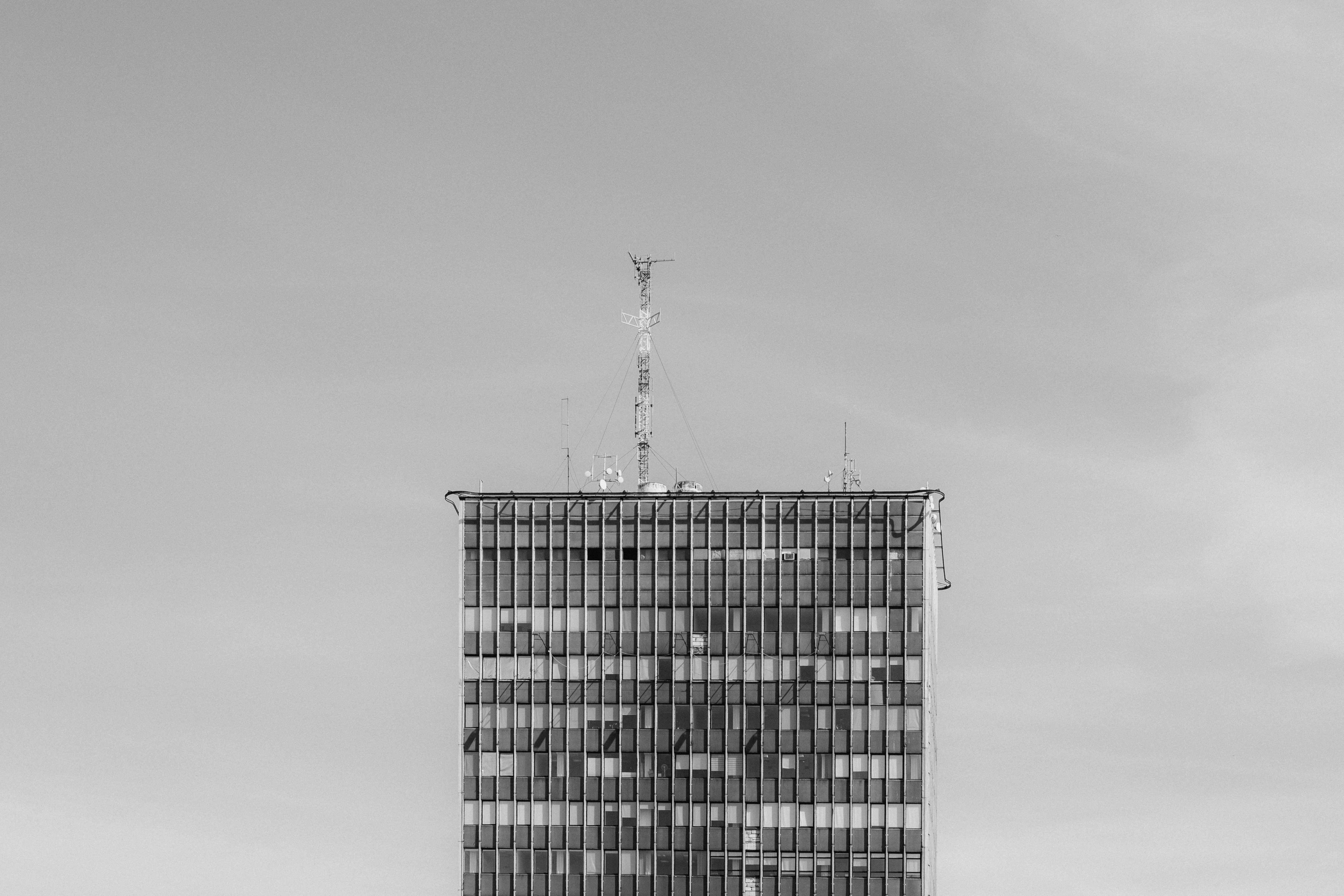 Top-Floor Sentinel: A Monolithic Tower Reaching Beneath An Open Sky