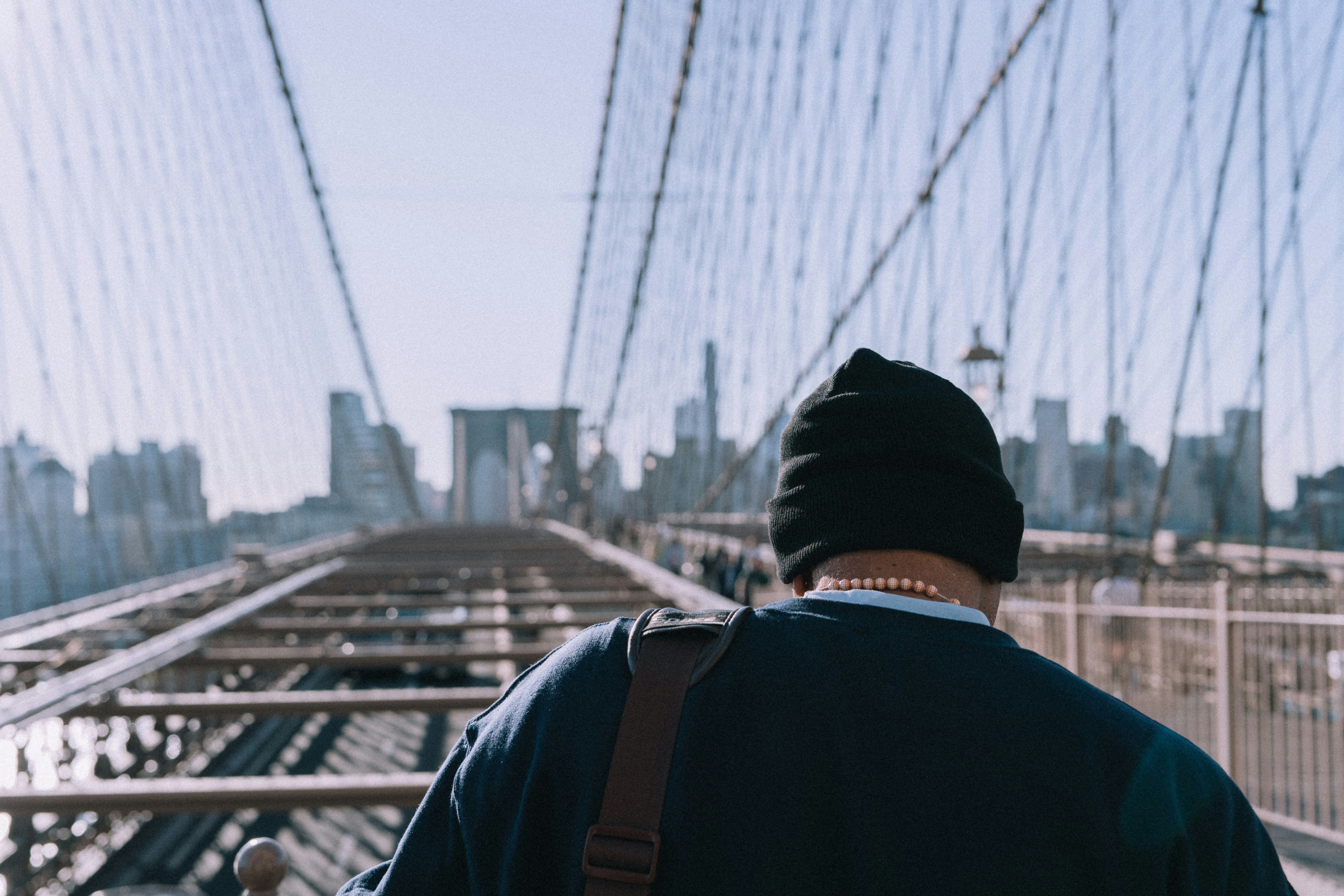 Oncoming Cityscape: A Backward Glimpse from the Bridge