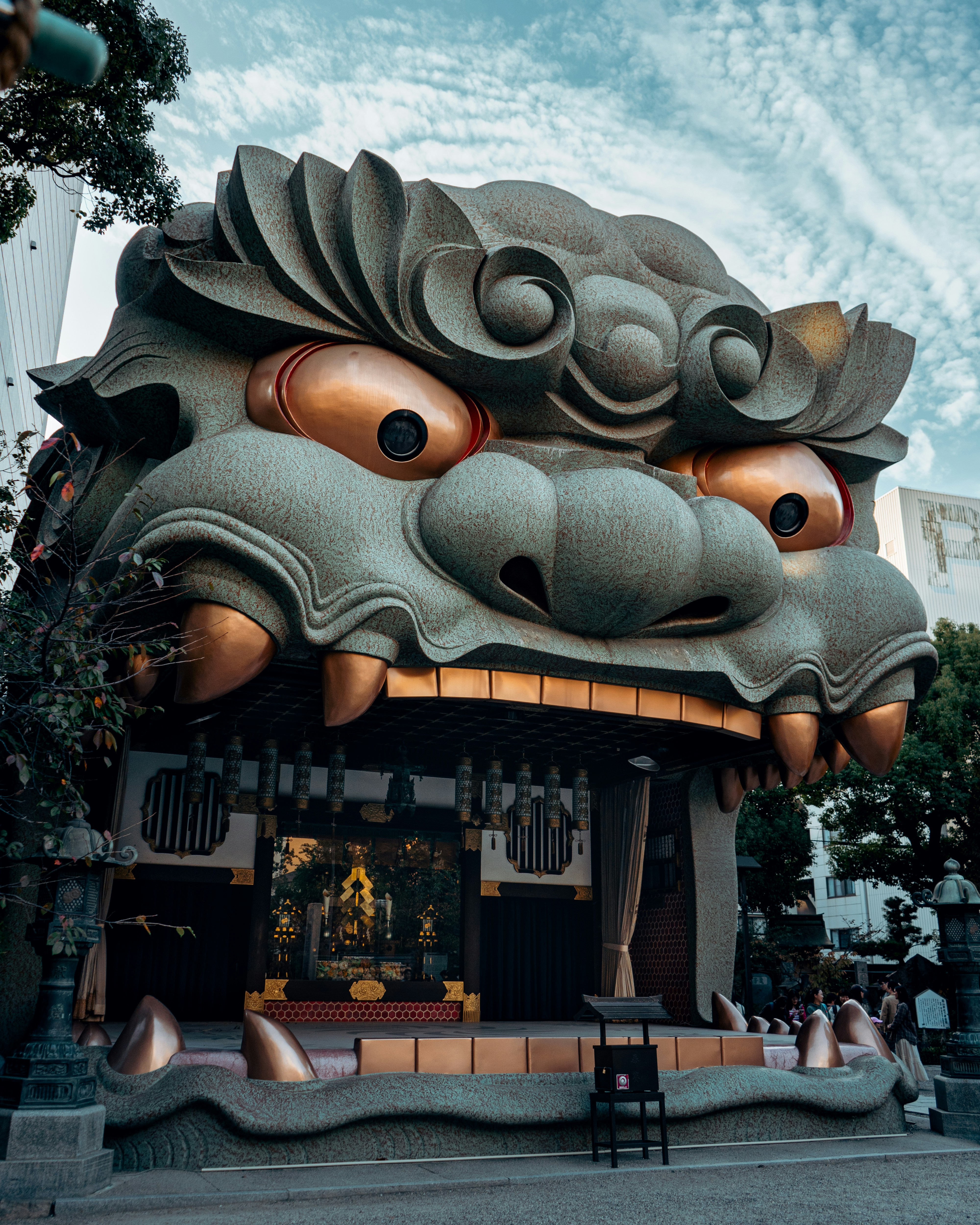 Giant Dragon's Head Overwatching a Lantern-lit Shrine