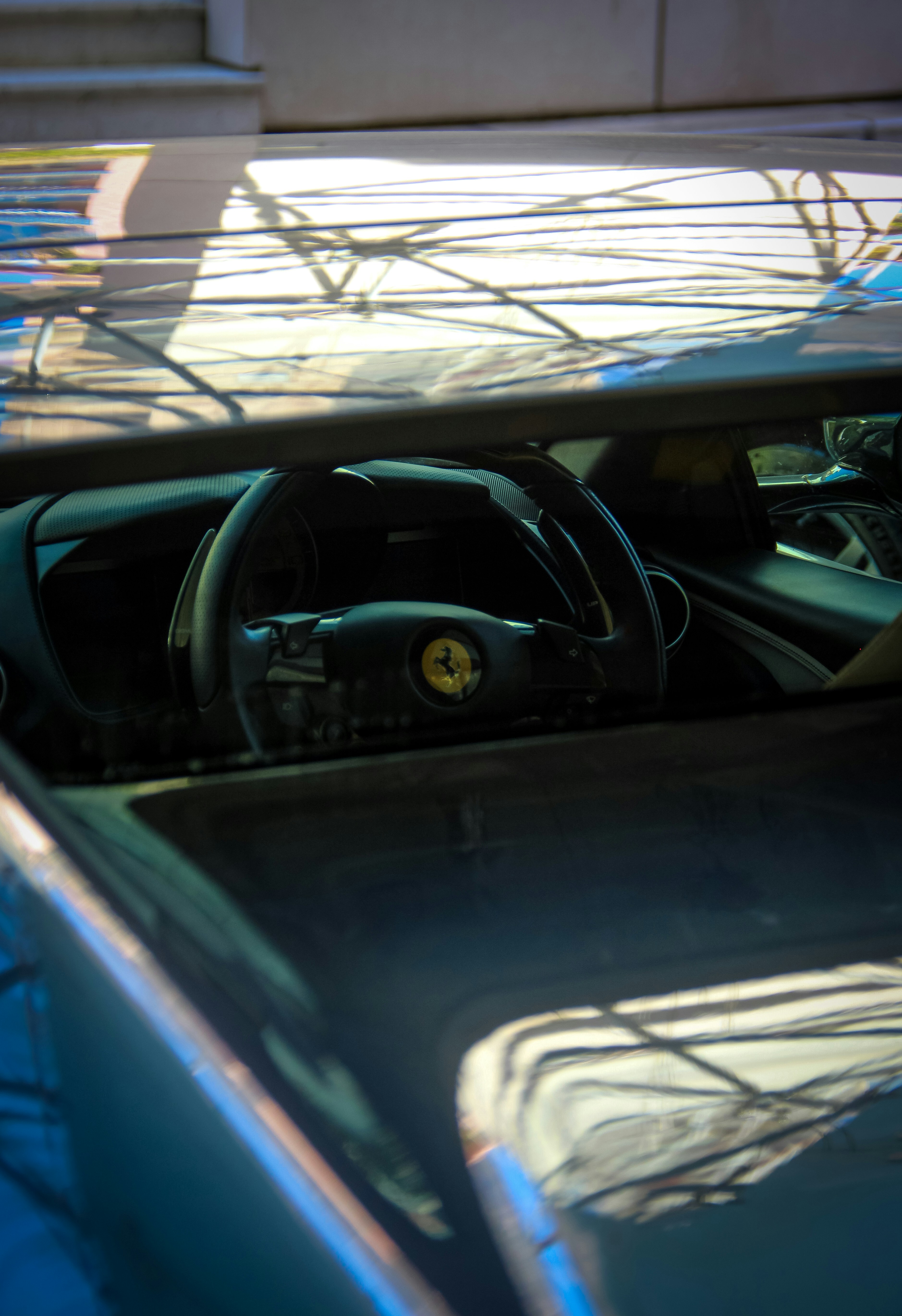 Ferrari Dash: The Car's Cockpit Reflected in a Shifting Glimpse