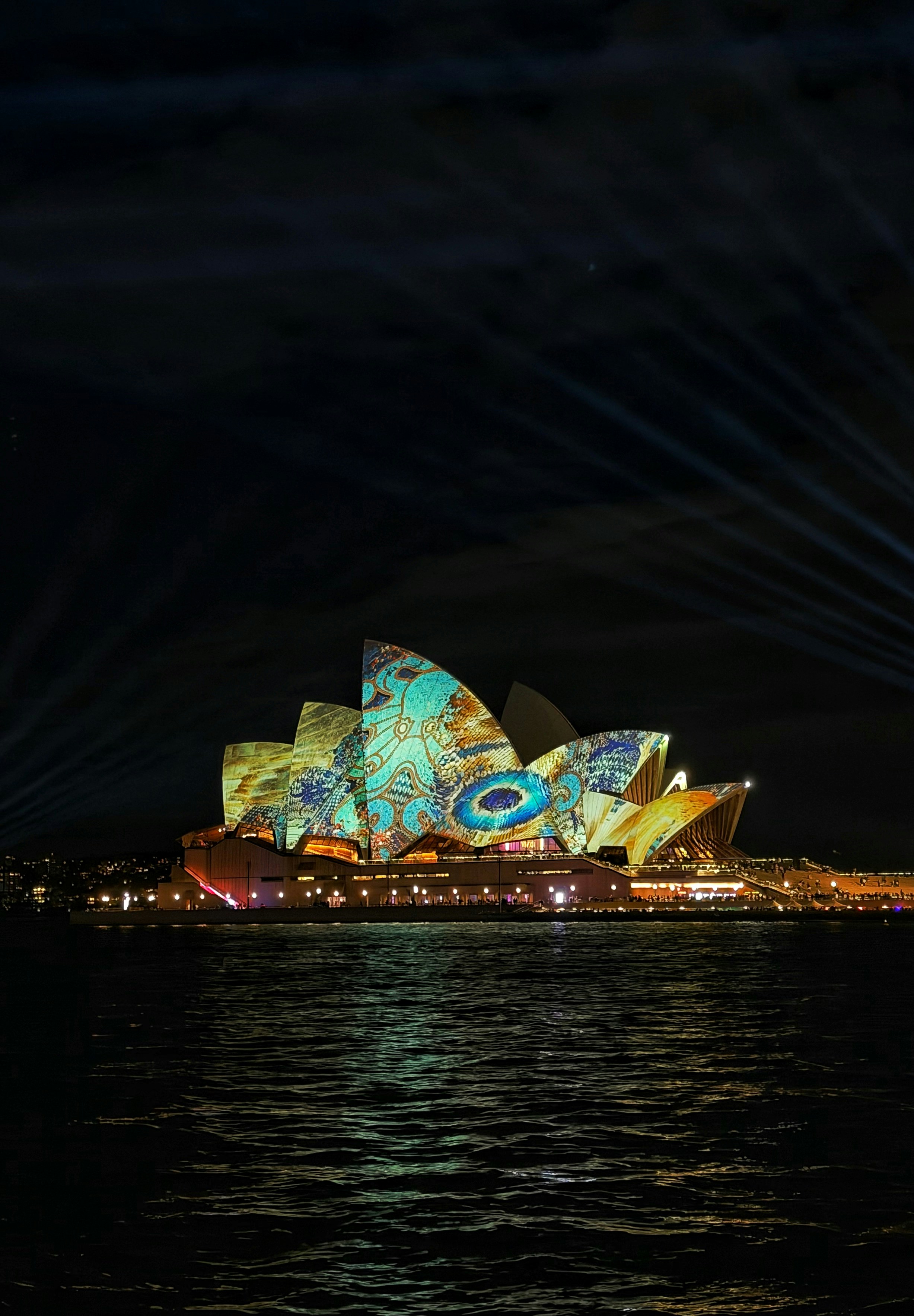 Colorful sails at night: Sydney Opera House lit with patterned projection