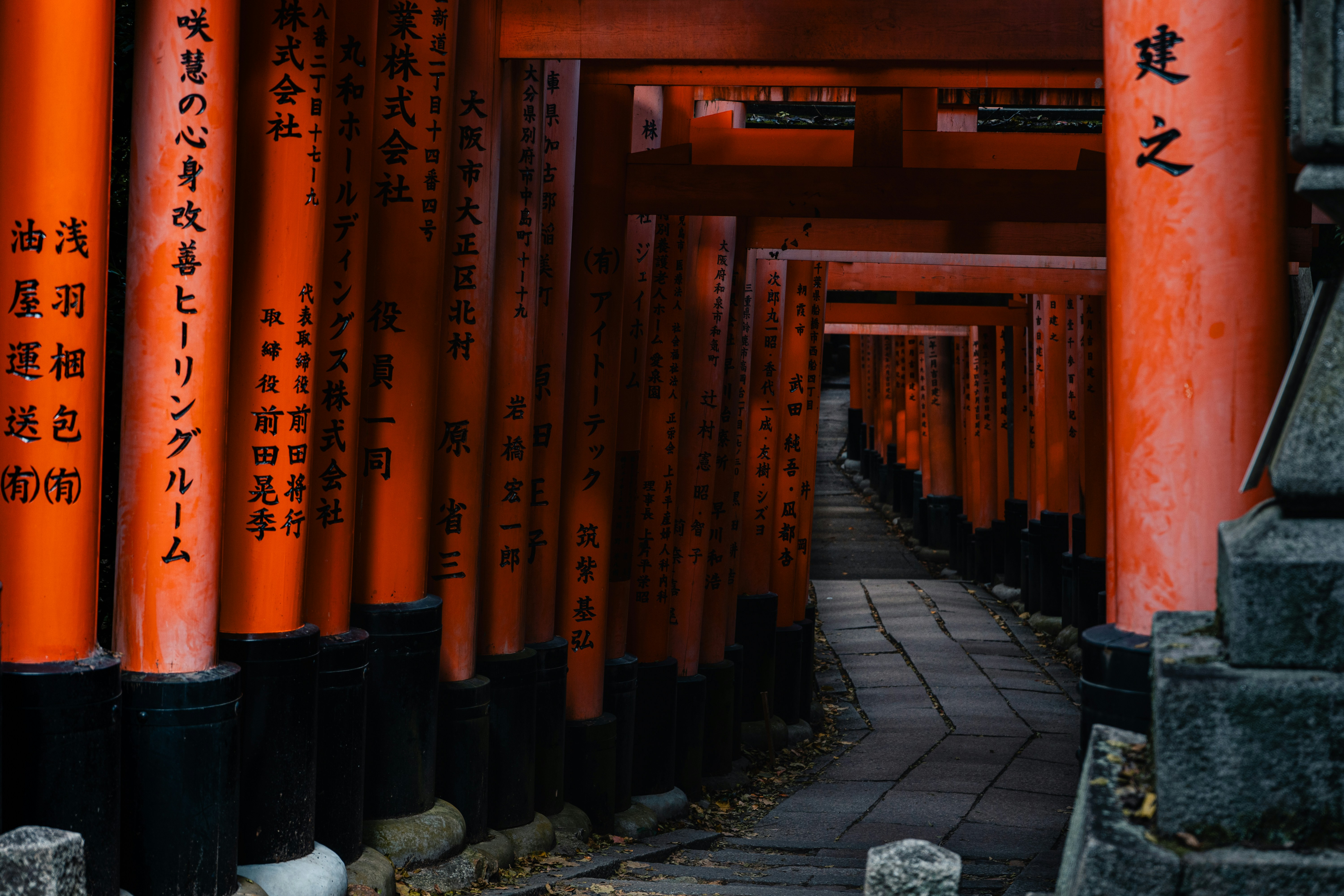 Red Corridor of Quiet Steps under Ashlar Torii