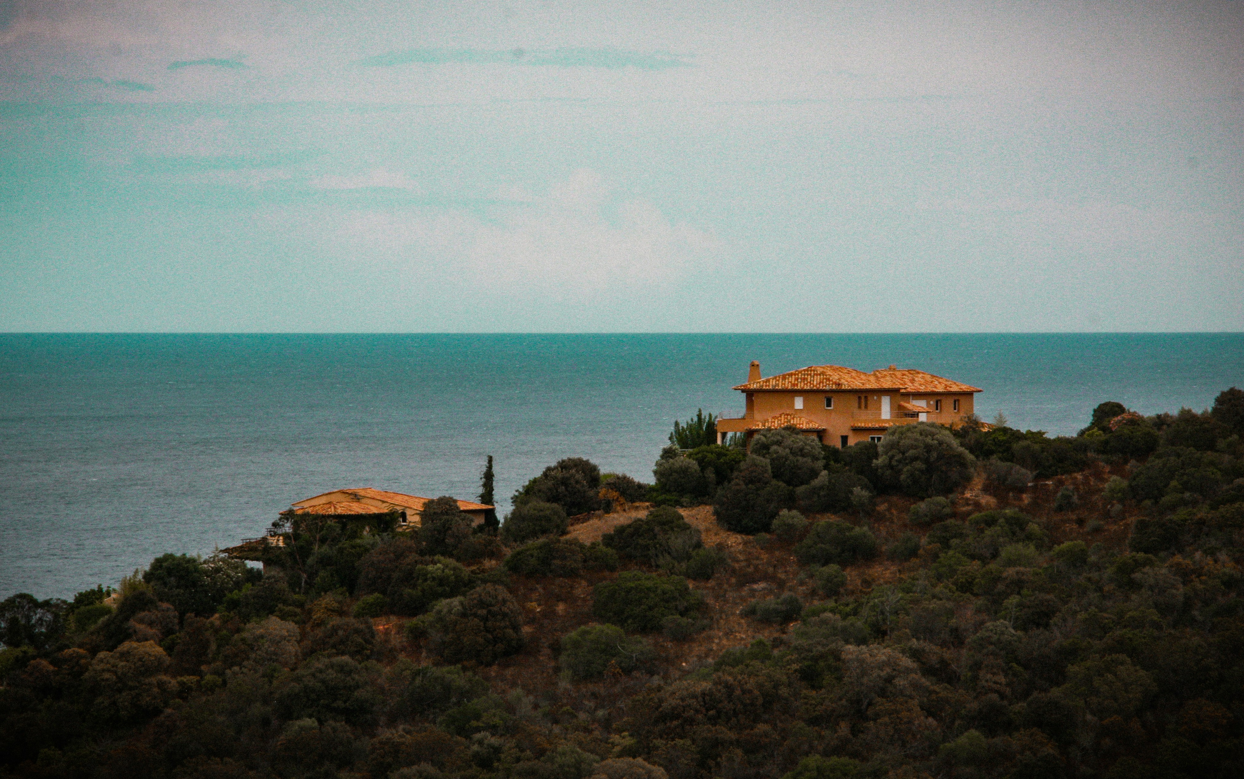 Terraced hillside villa gazes toward a calm sea