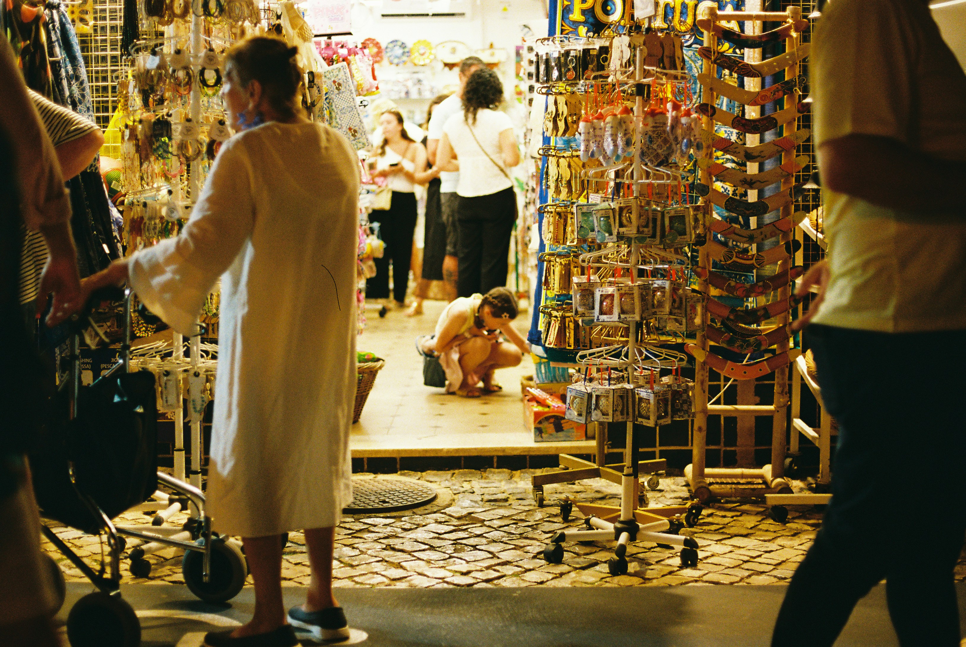 Night Market Quiet Between Shoppers and a Curious Child