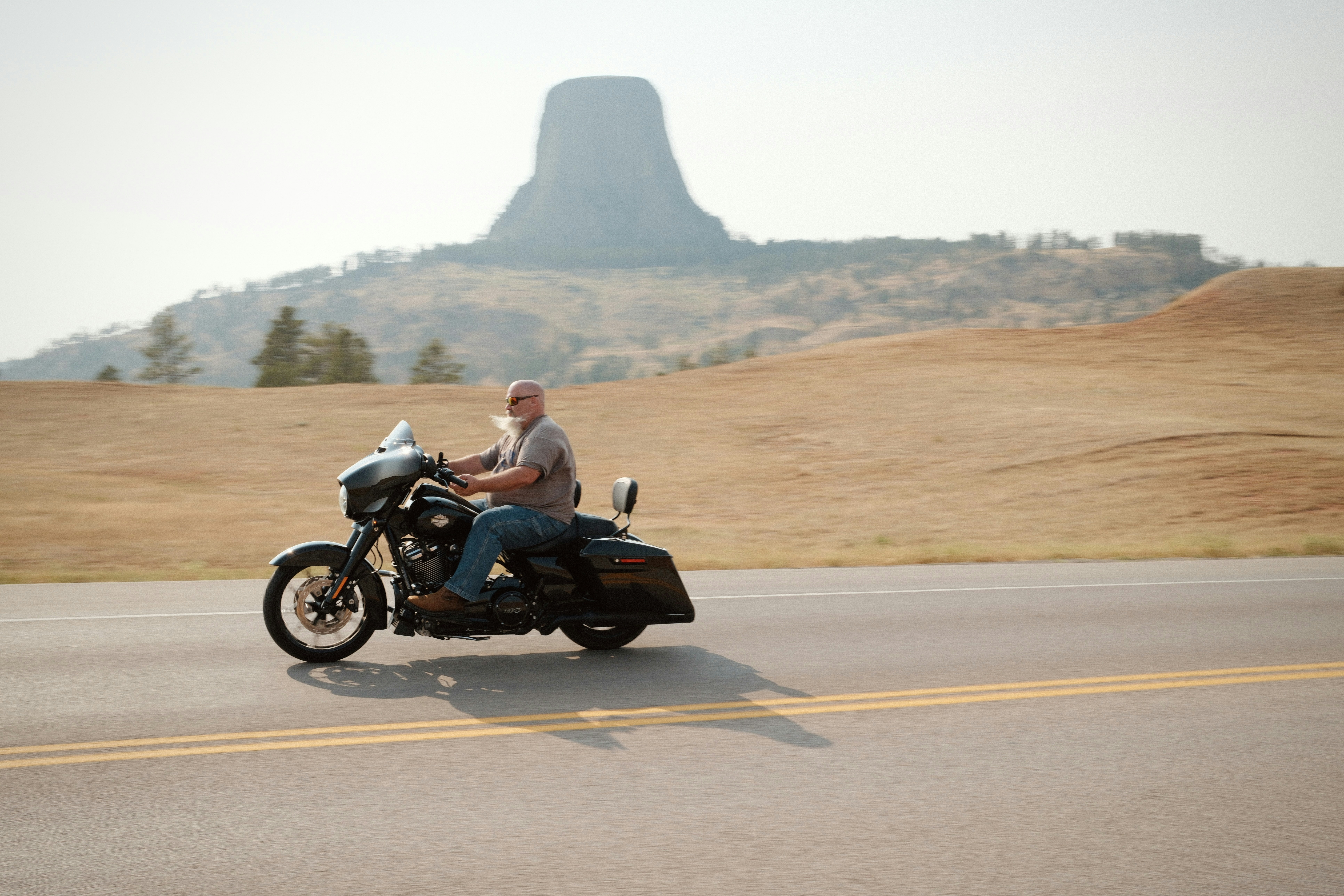 Ride with the Desert Backdrop: A Rider in Mid-Stride on an Open Highway