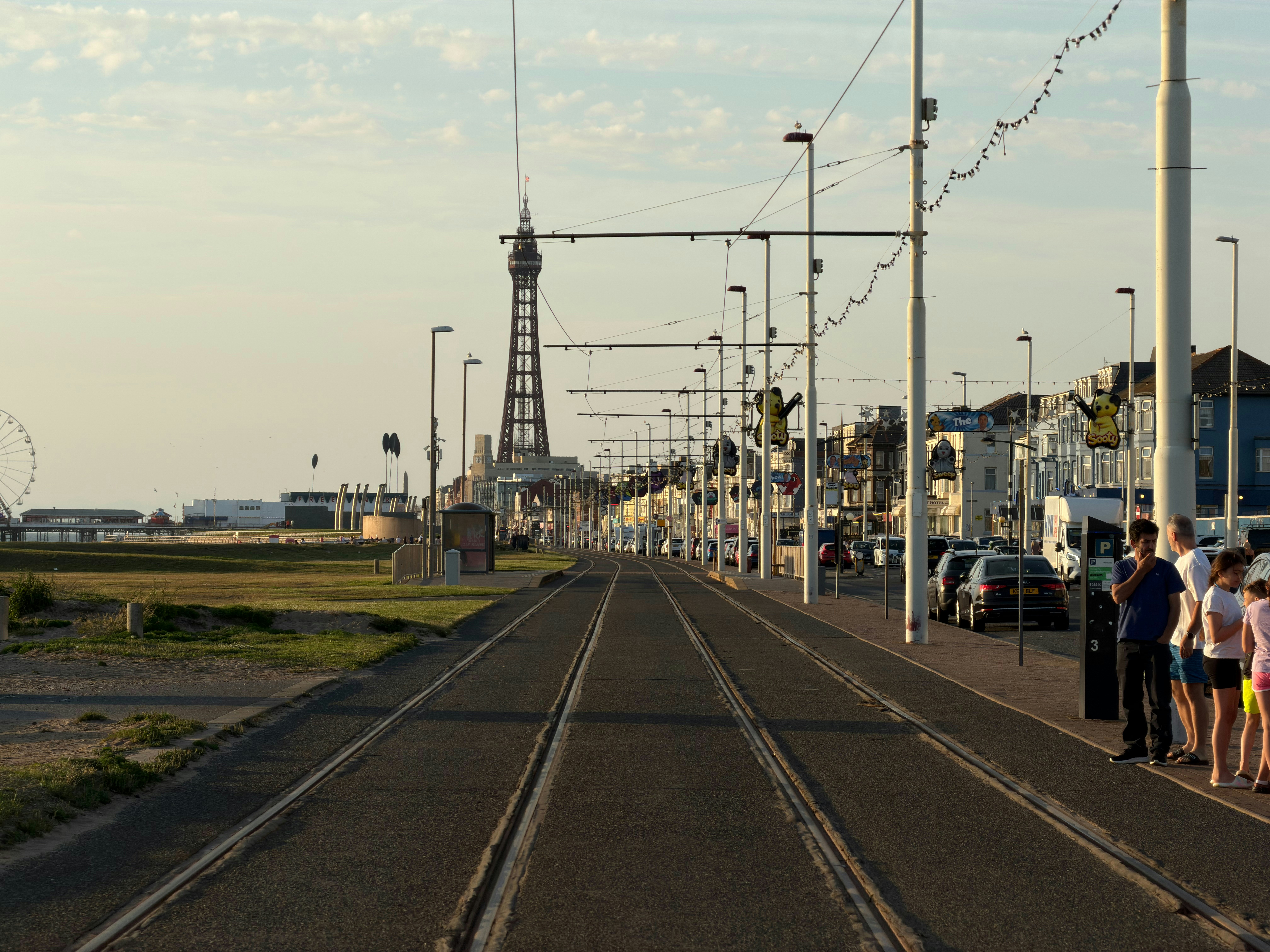 Rails at Dawn: A Pier-Side Street Walk