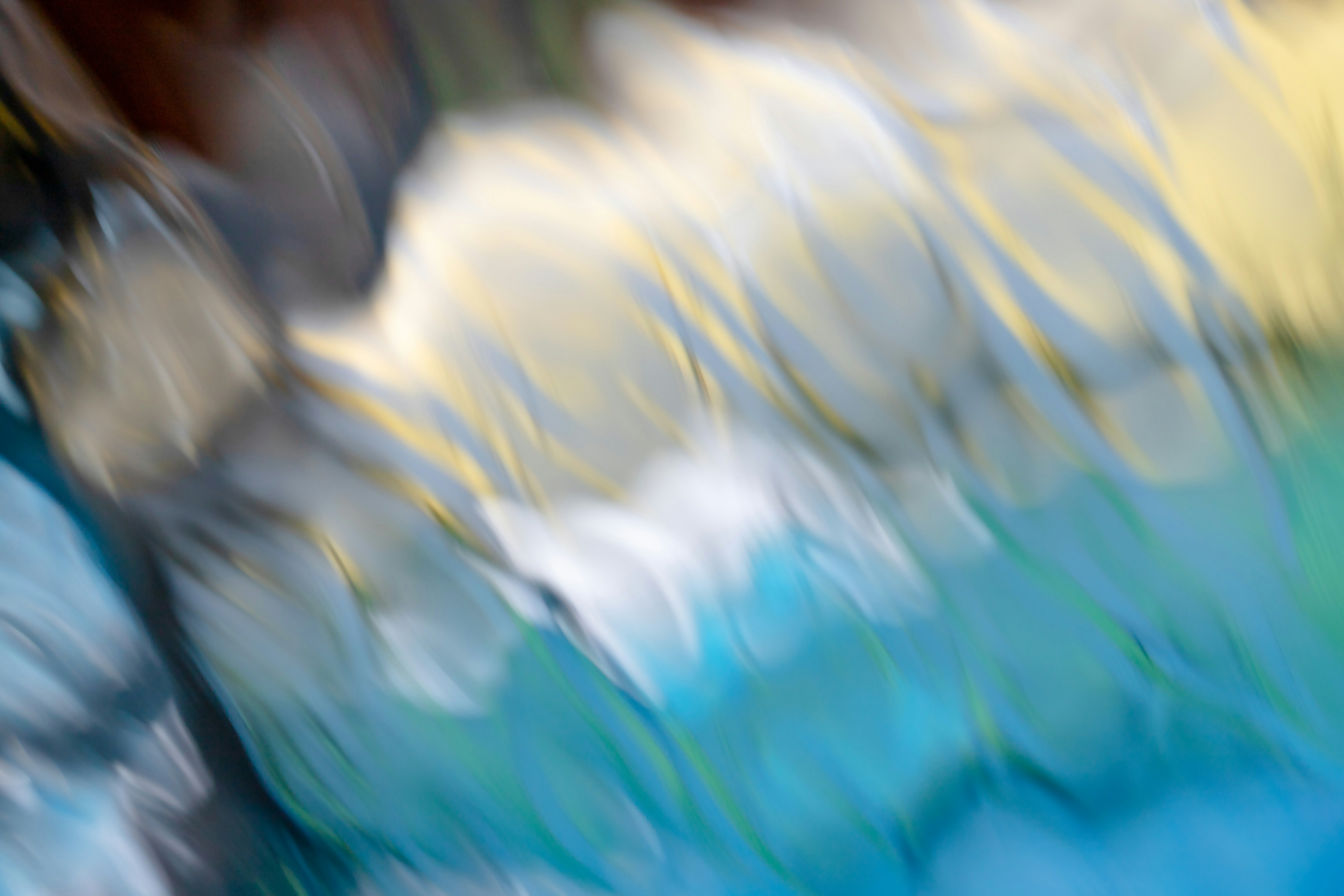 Blurry Motion of Figures Over a Turquoise Gradient
