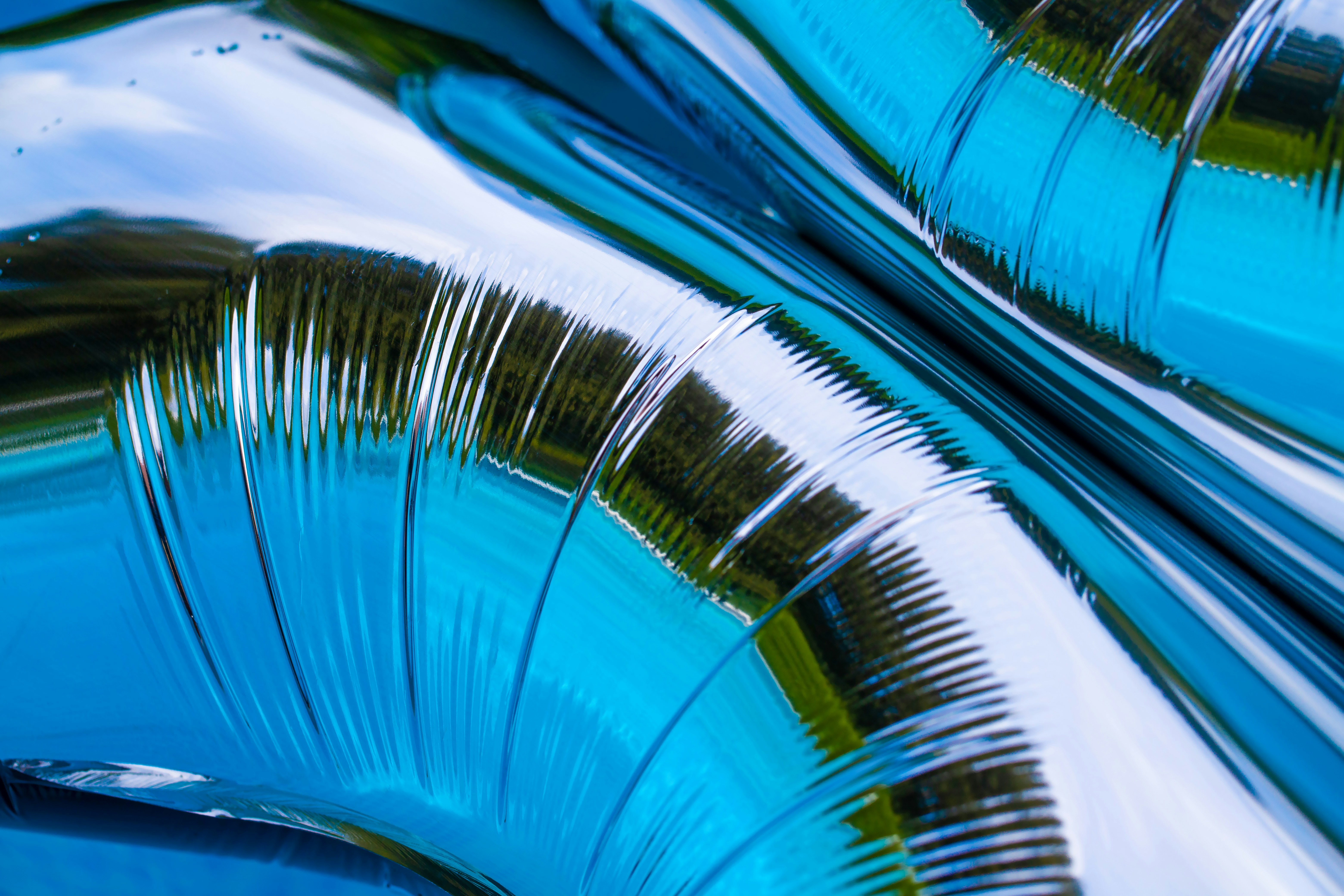 Liquid Chrome: Abstract Blue Reflections in Motion