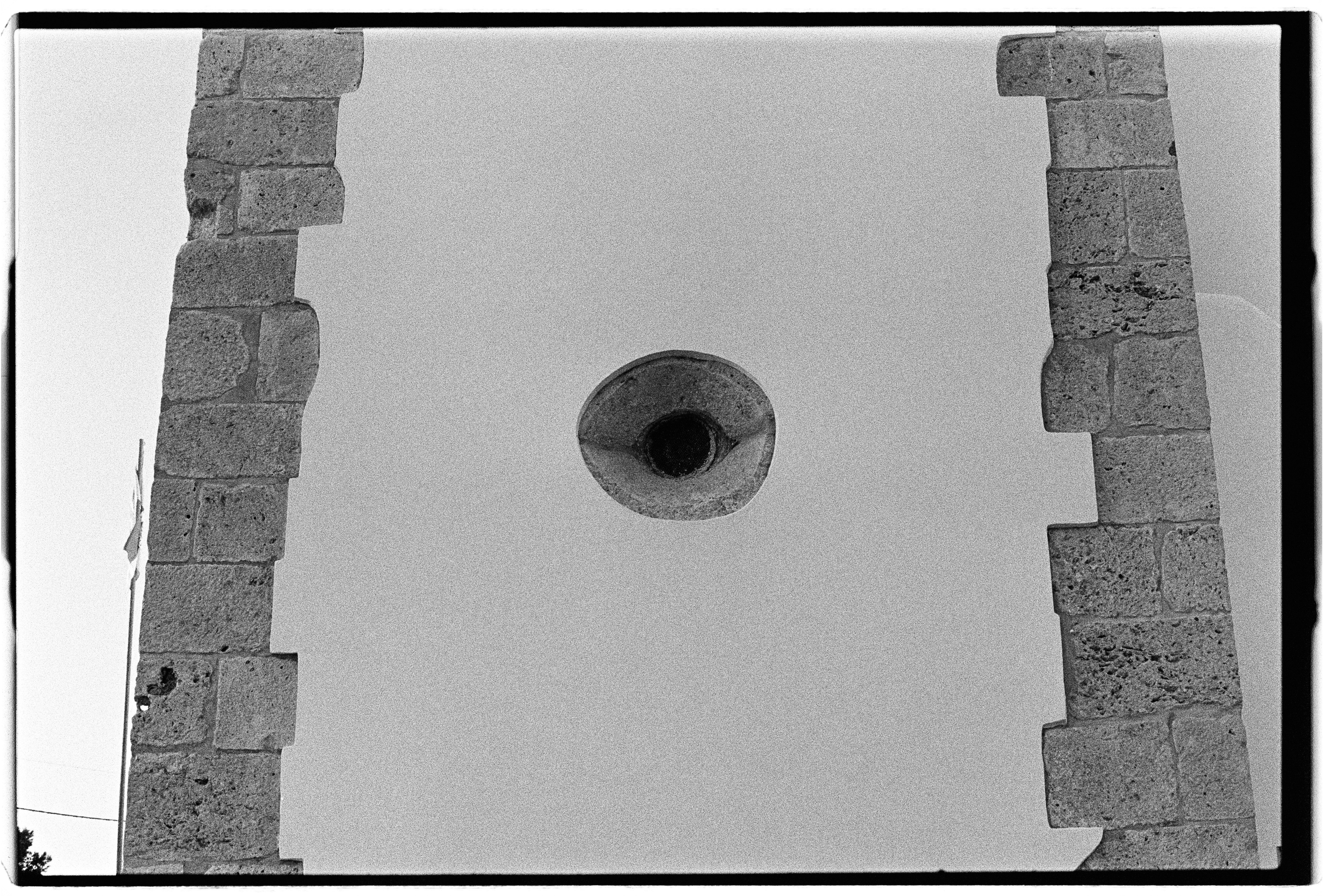 Stone Archway Window: Circular Aperture in a Framed Sky