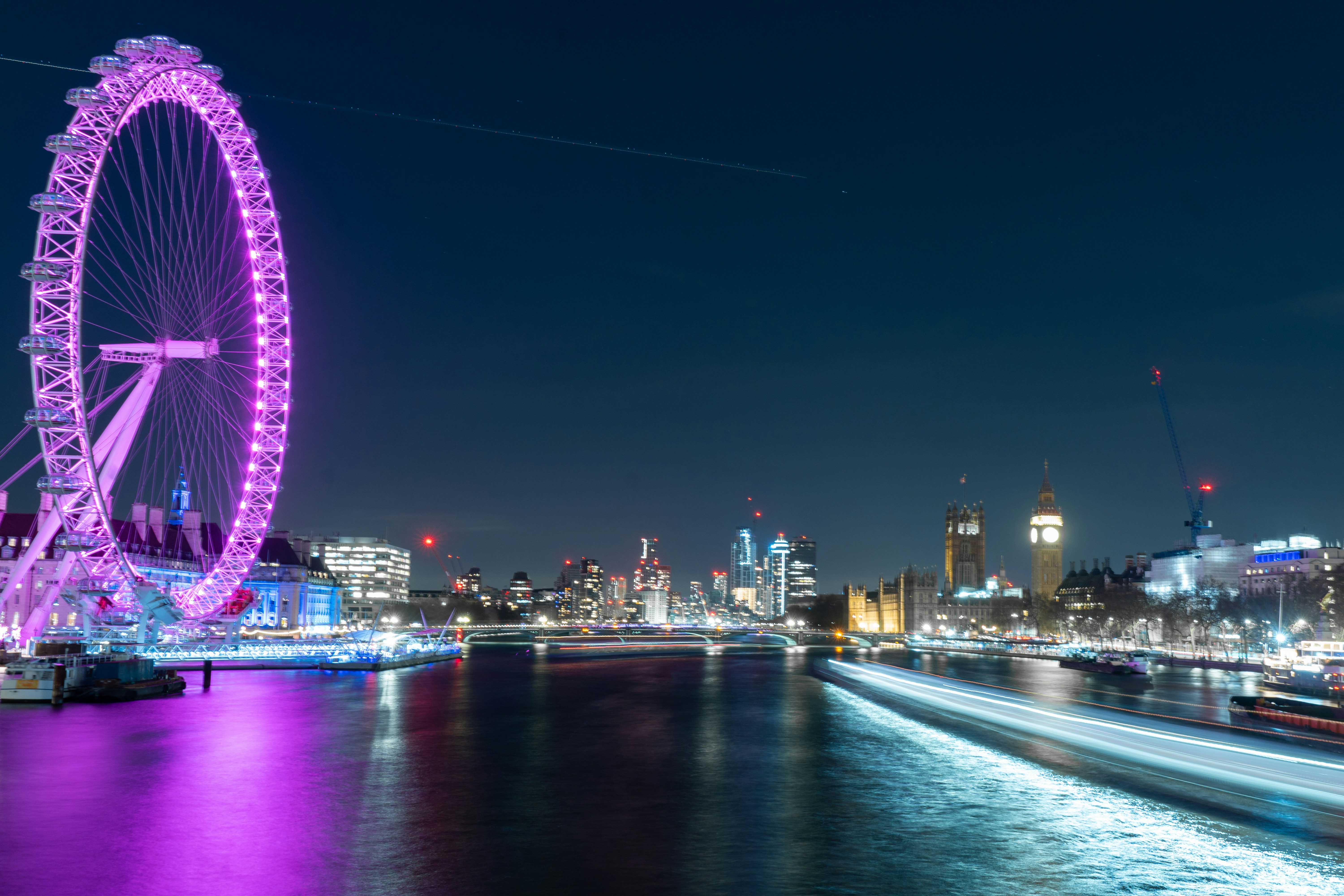 Neon Ring Over the Thames: The London Eye Beckons at Dusk