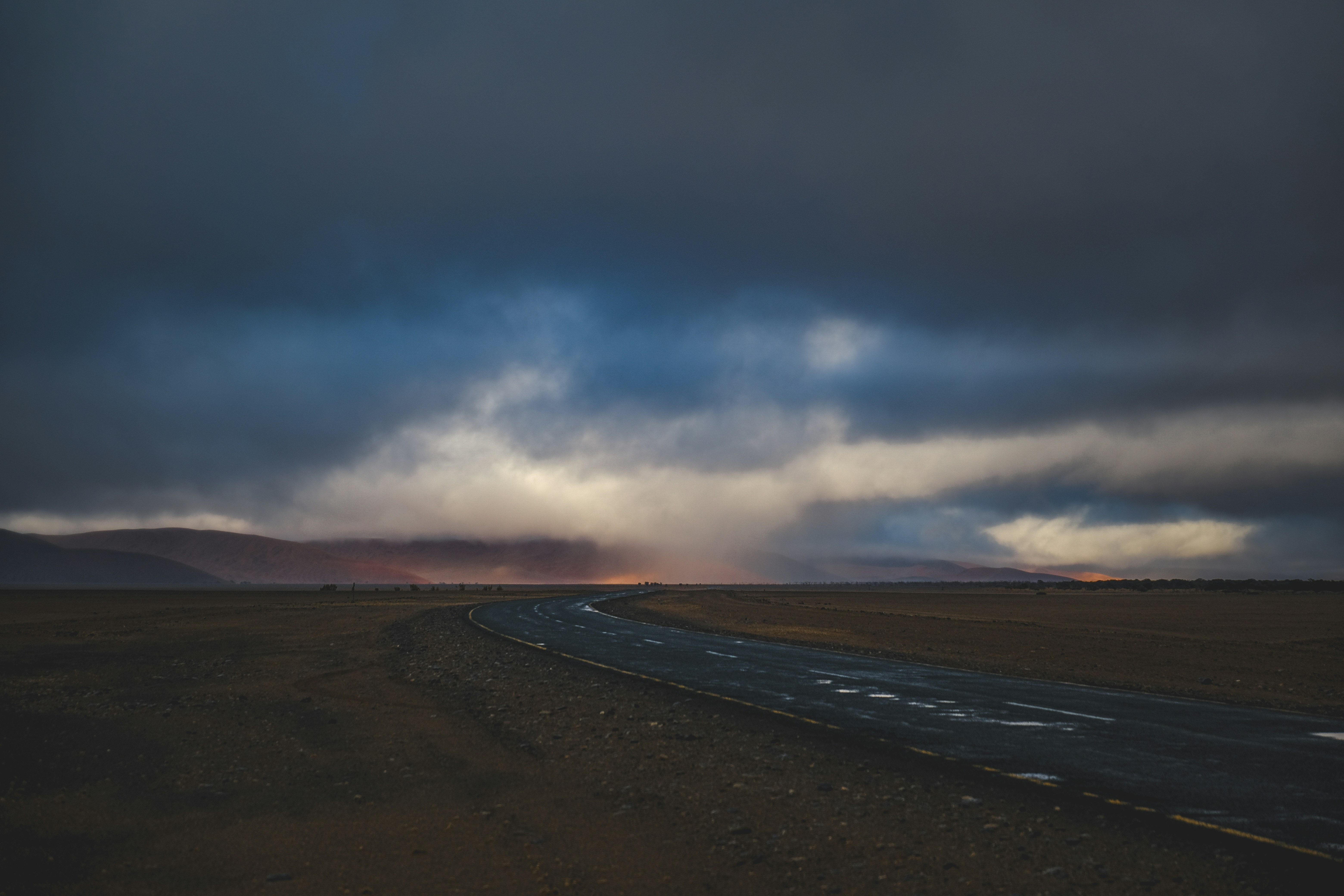 Desert Road at Dusk: A Quiet Drift Toward the Horizon