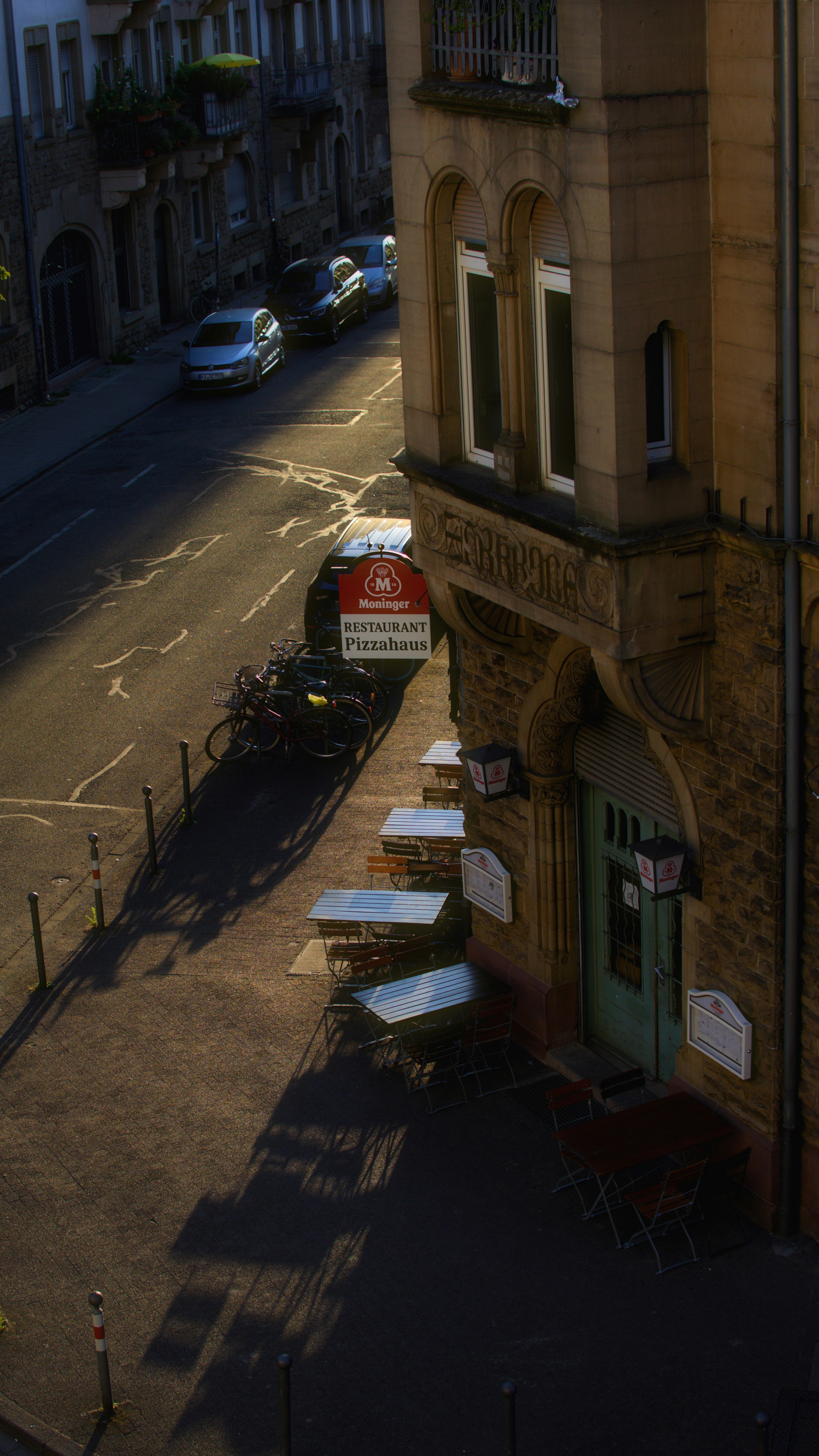 Evening on a Quiet Street: Bistro Sign and Shadowed Facade
