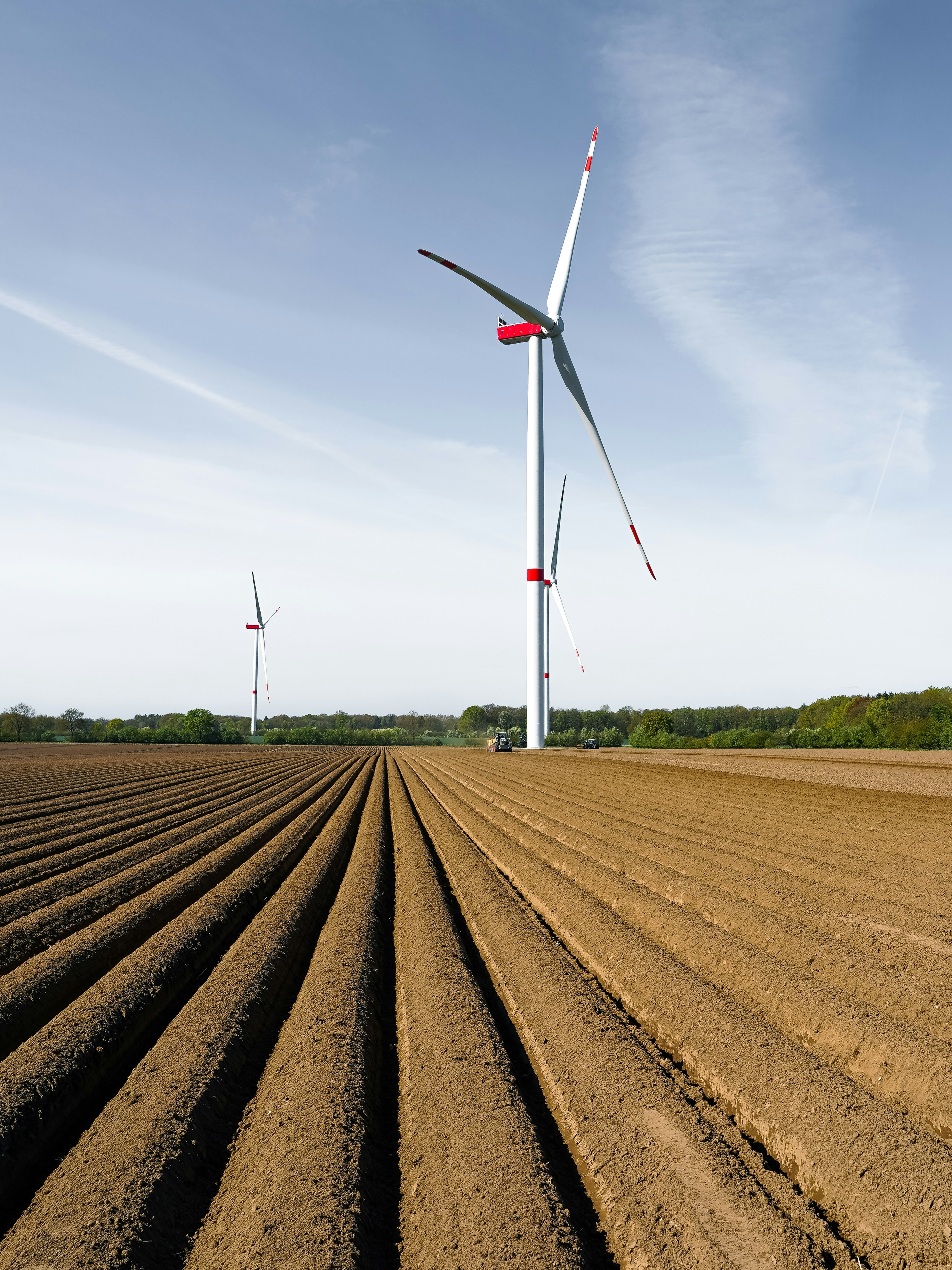 Wind Turbine Horizon: Precision Rows in a Plowed Field