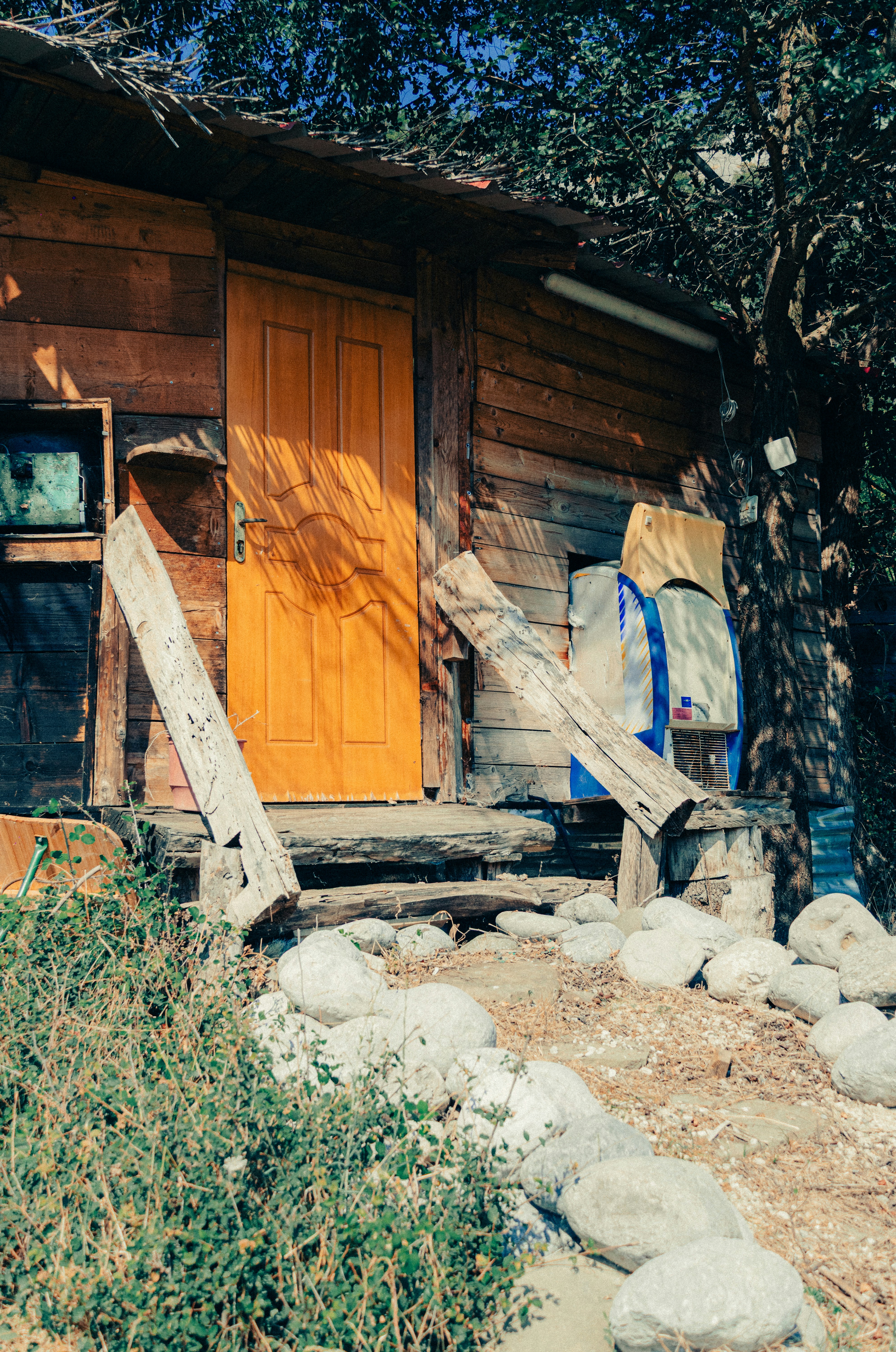 Bright Orange Door on a Weathered Cabin